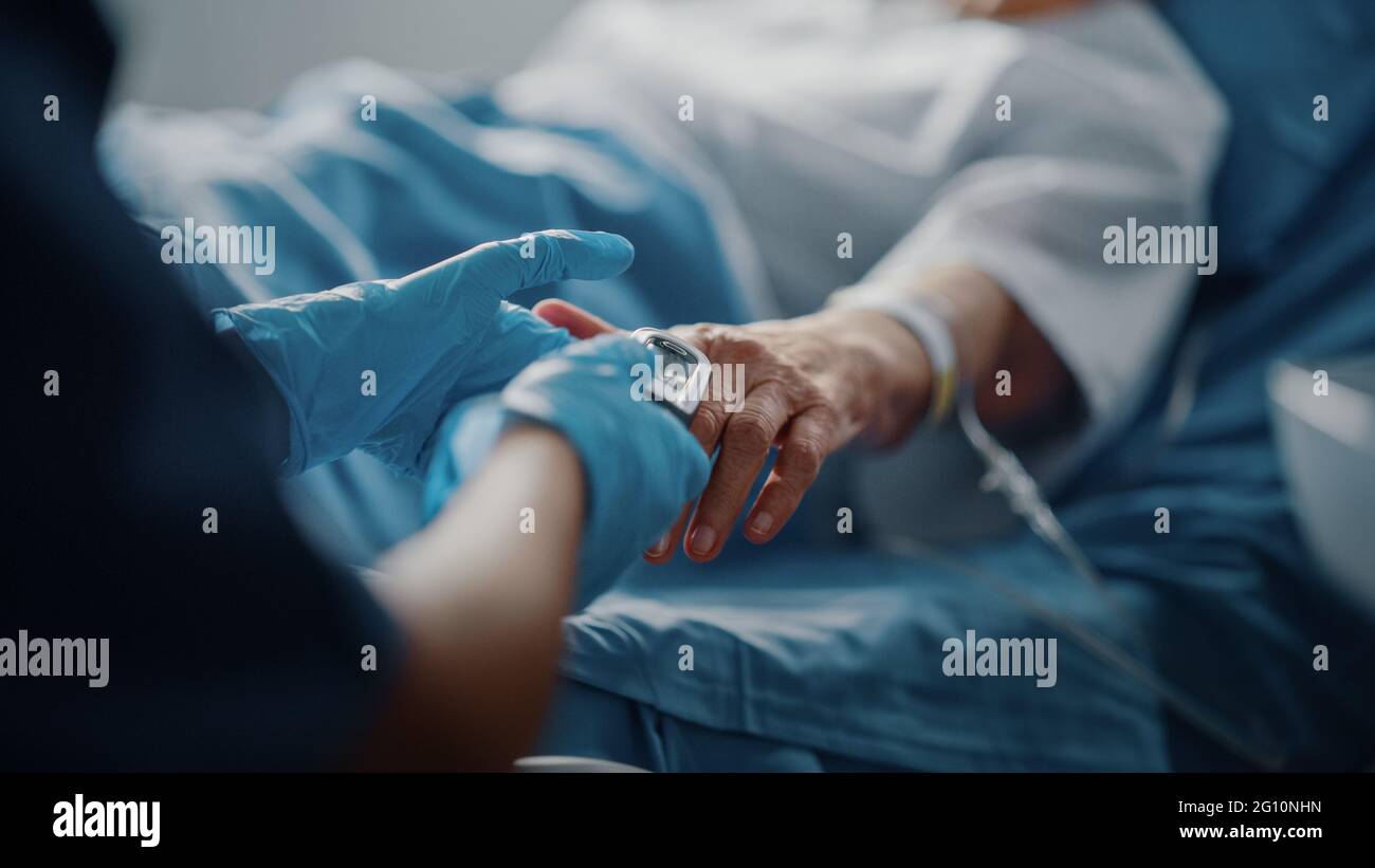 Hospital Ward: Senior Female Resting in a Bed Nurse Has Finger Heart ...