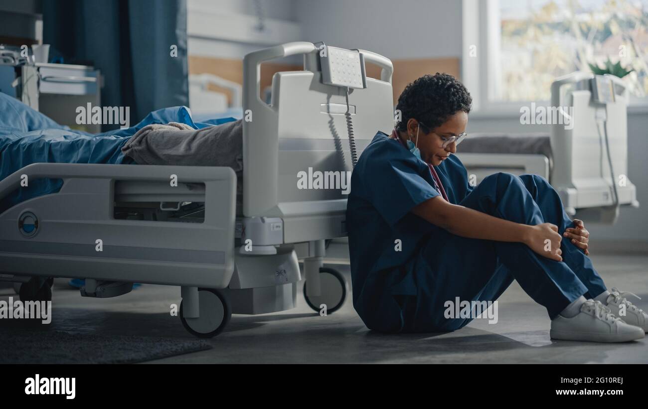 Sad surgeon sitting on floor hi-res stock photography and images - Alamy