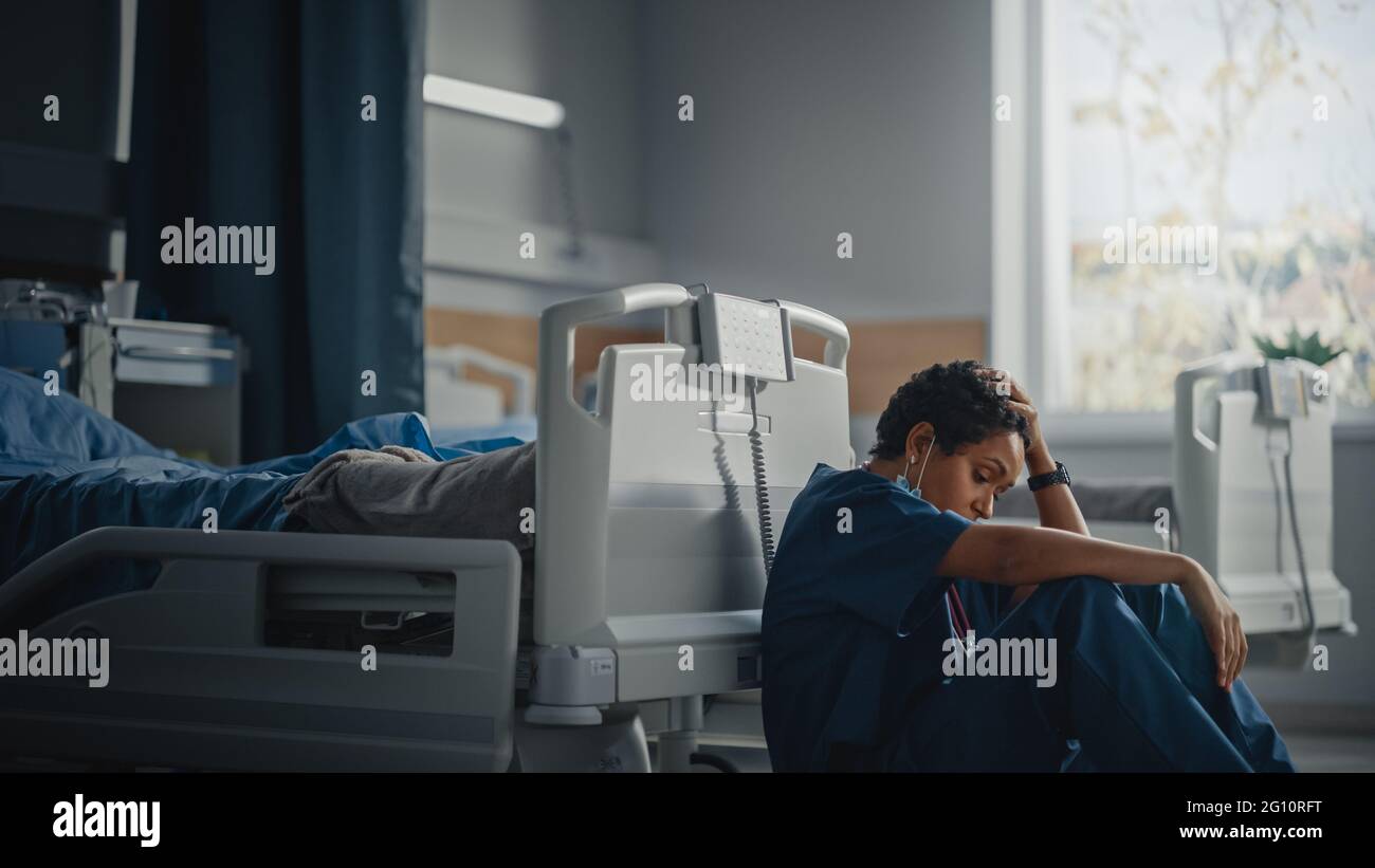 Hospital Intensive Care Coronavirus Ward: Portrait of Sad, Tired Black ...