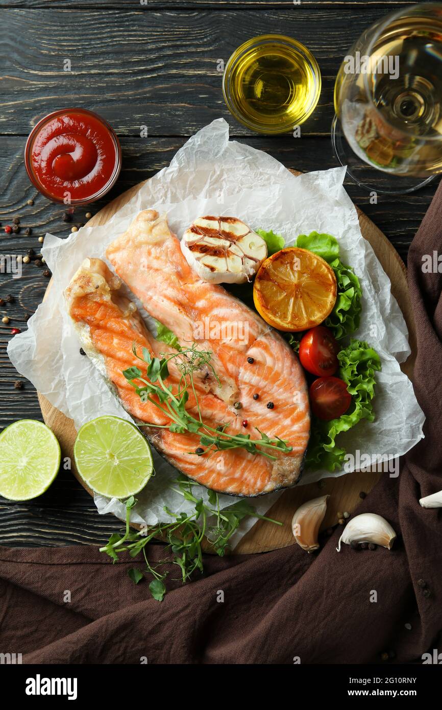 Concept of tasty eating with grilled salmon, top view Stock Photo - Alamy