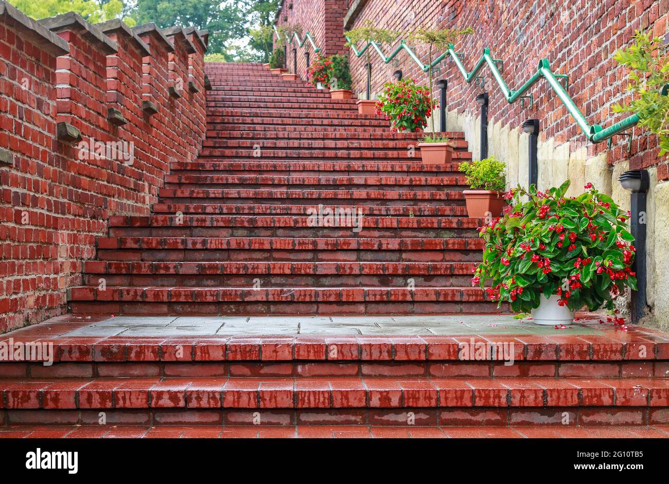 Wide brick stairs decorated with flowers. Summer time Stock Photo - Alamy