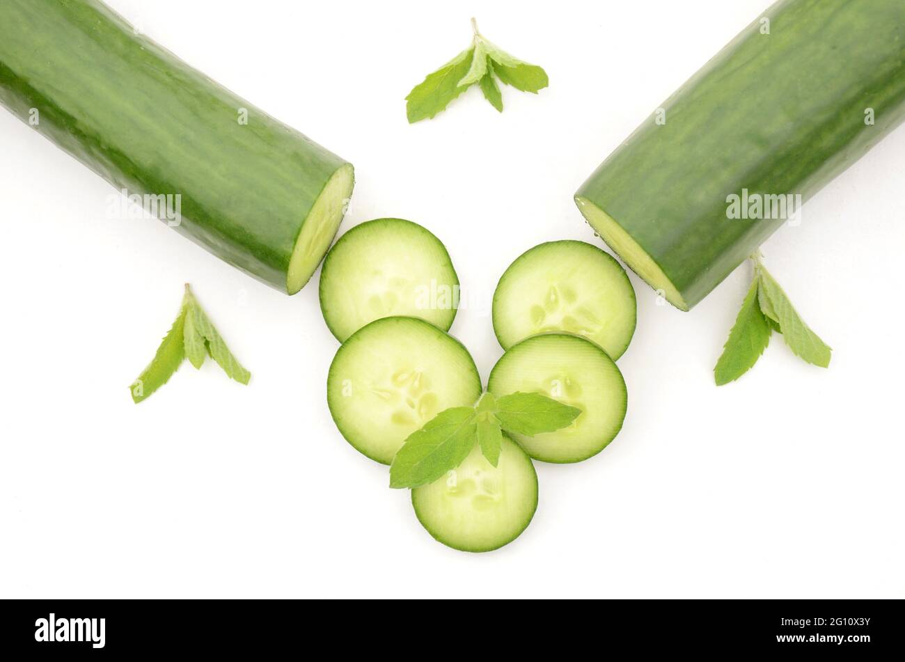 closeup sliced green ripe cucumber with mint isolated on white ...