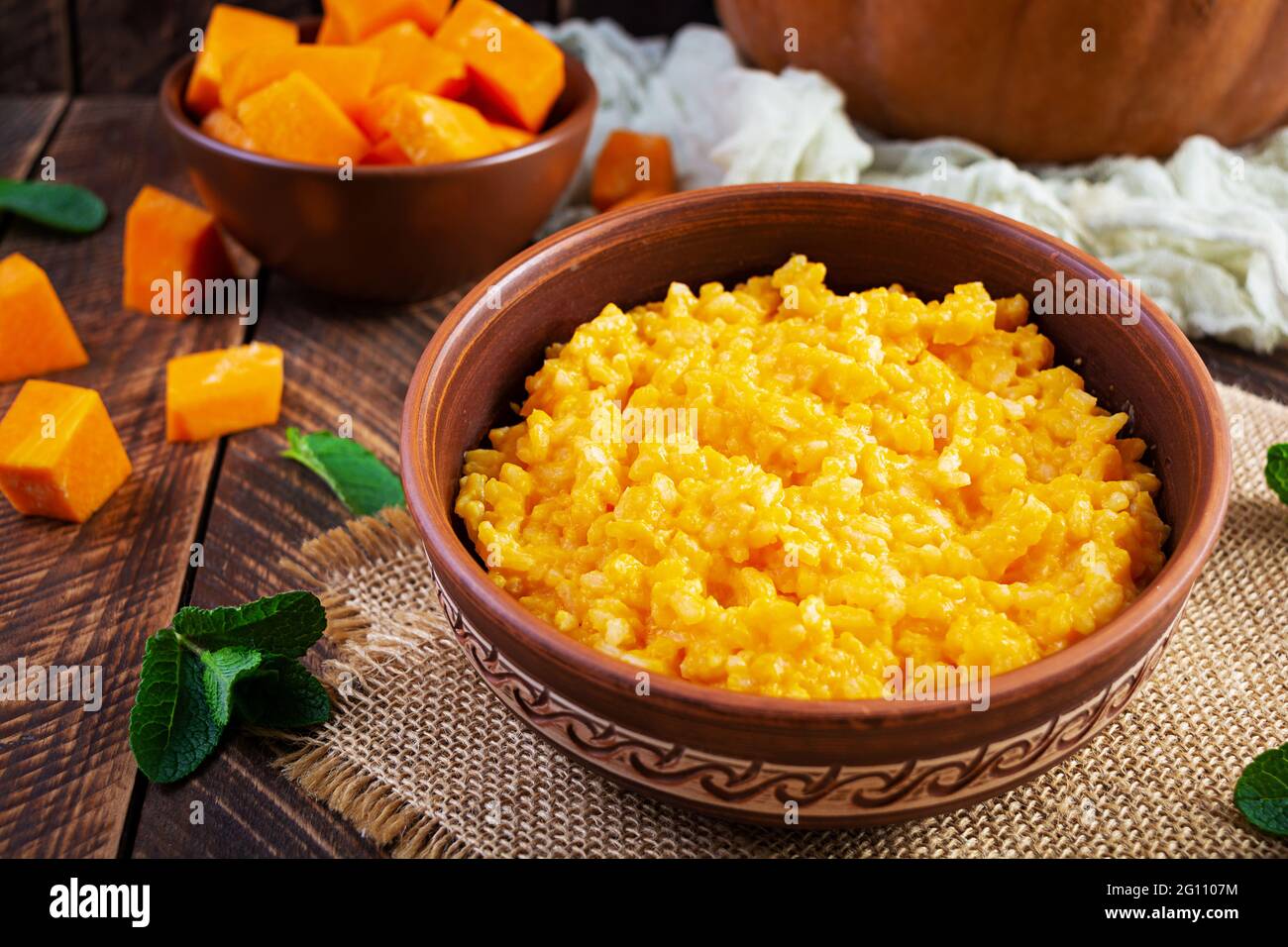 Delicious homemade pumpkin porridge on wooden background. Healthy vegan ...