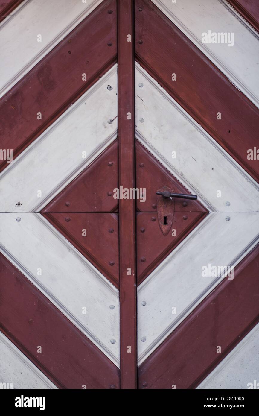 Closeup shot of a wooden door with rotated red and white squares - for ...