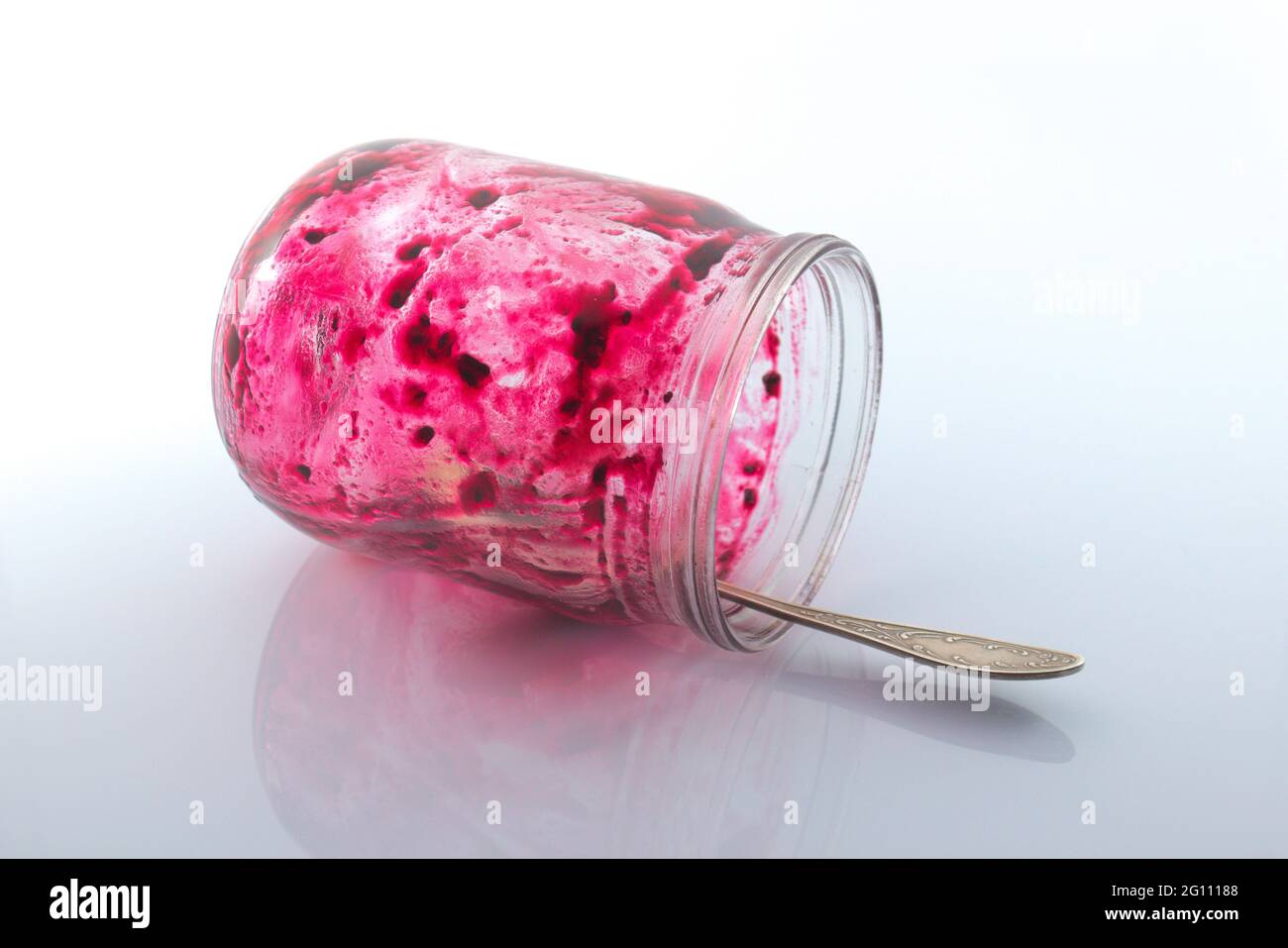 Empty jar of jam on mirror background Stock Photo - Alamy