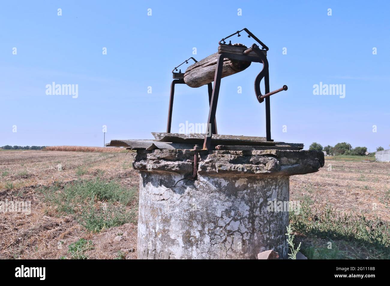 Old abandoned water well in the field Stock Photo - Alamy