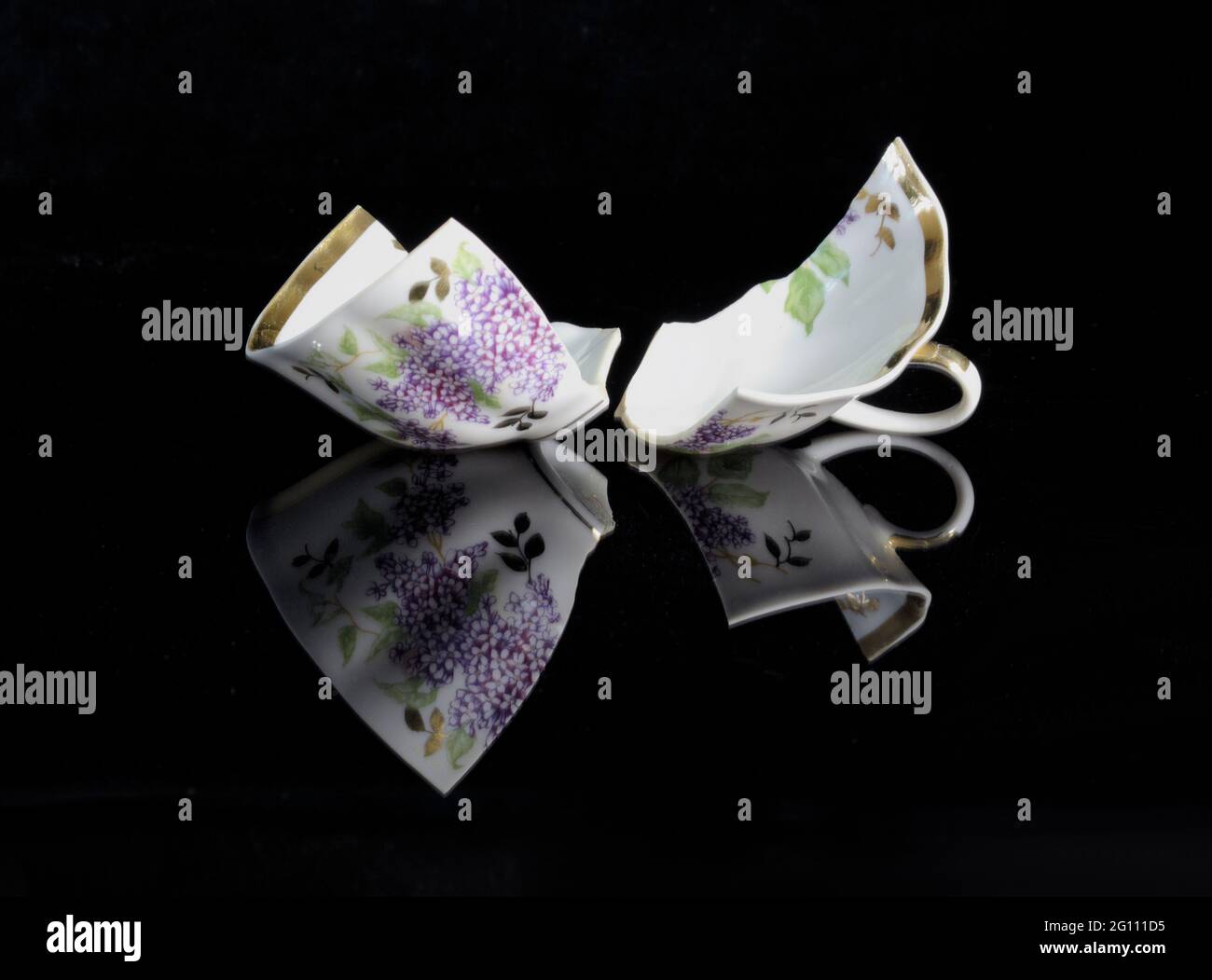 Broken beautiful cup in black mirror background. Concept Stock Photo ...