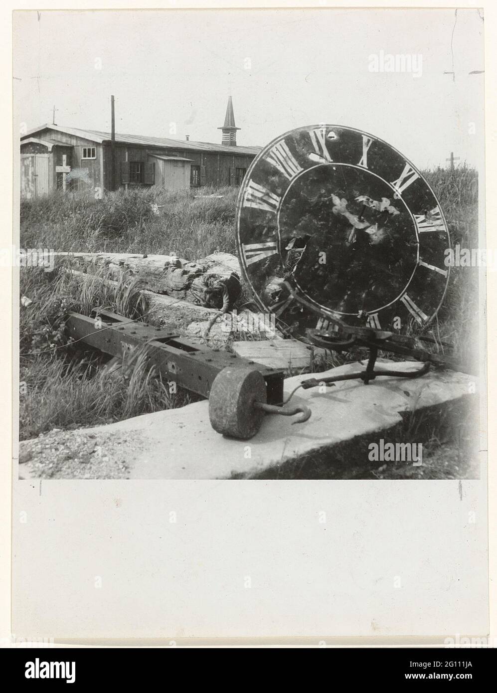 A broken clock. There is a broken dial of a clock on a few wooden beams ...