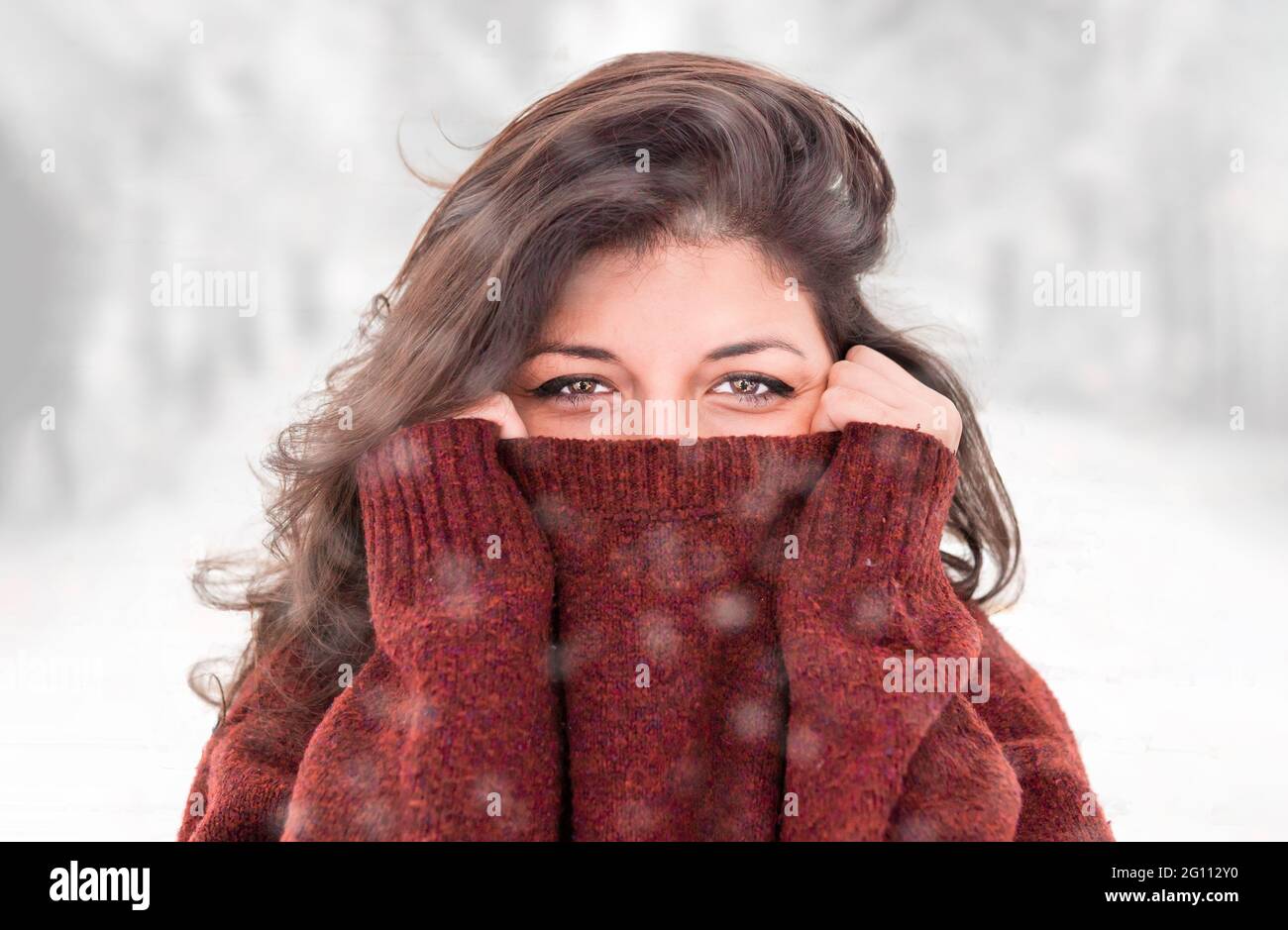 Outdoor close up portrait of a young beautiful girl wearing a wool ...