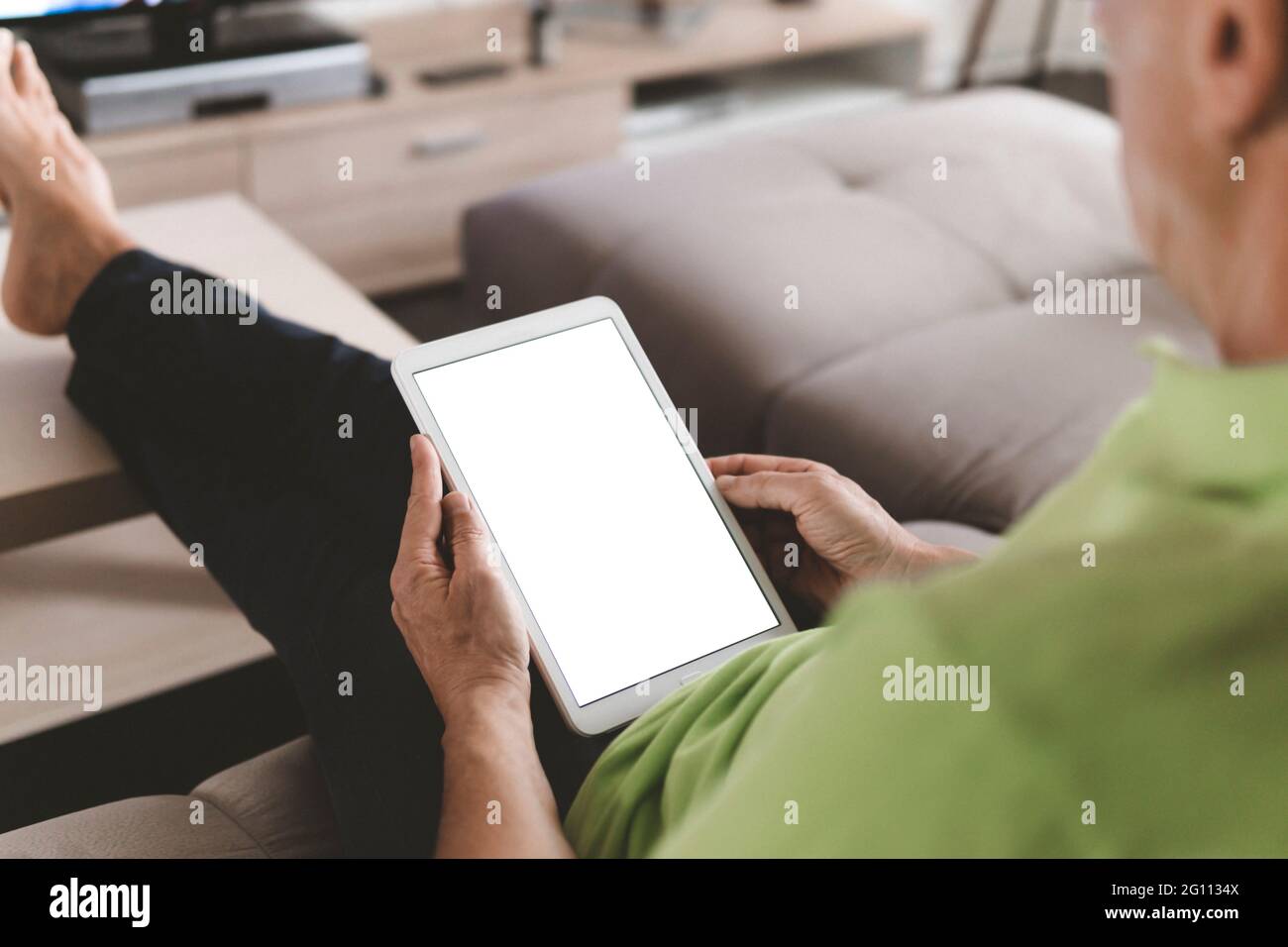 Close up of adult man hands typing on tablet - Man holding pc tablet at ...