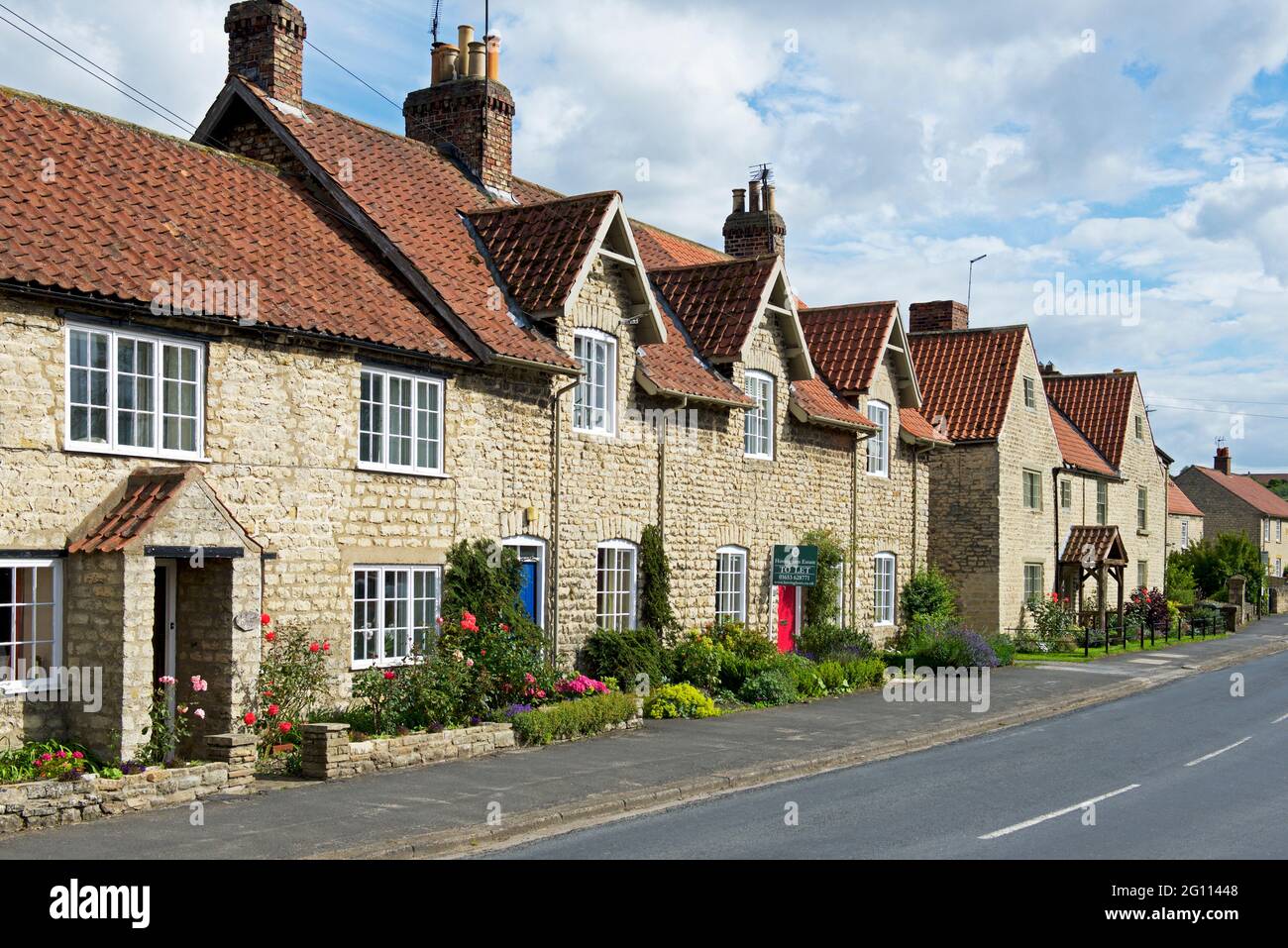 Row of houses in the estate village of Hovingham, North Yorkshire ...