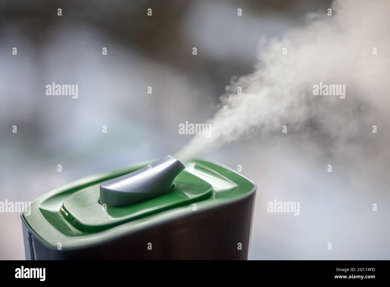 Humidifier spreading steam into the living room Stock Photo - Alamy