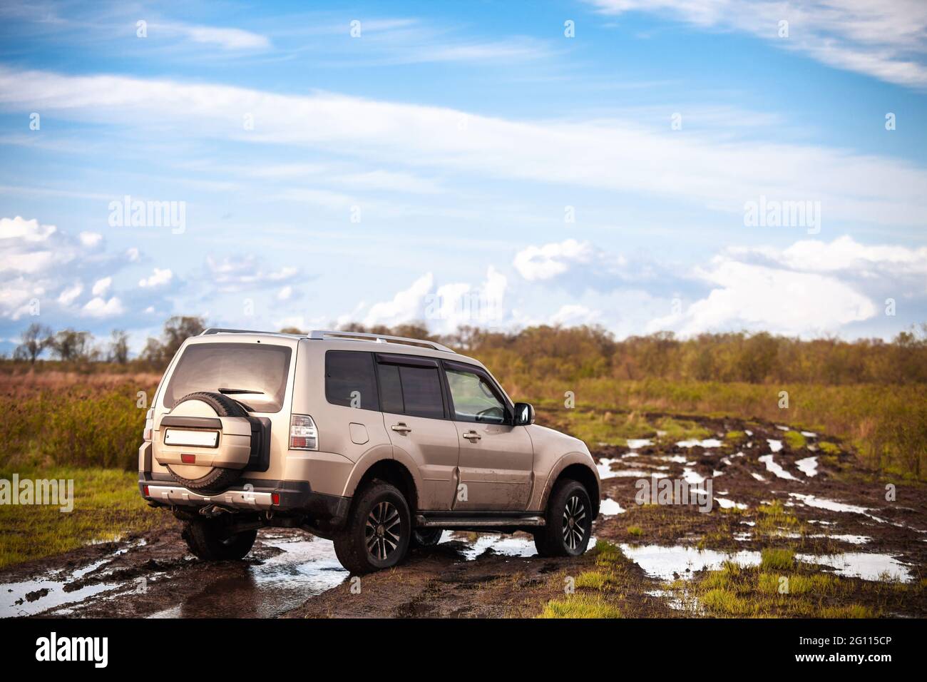 Mitsubishi Pajero/Montero at dirt road after rain Stock Photo - Alamy