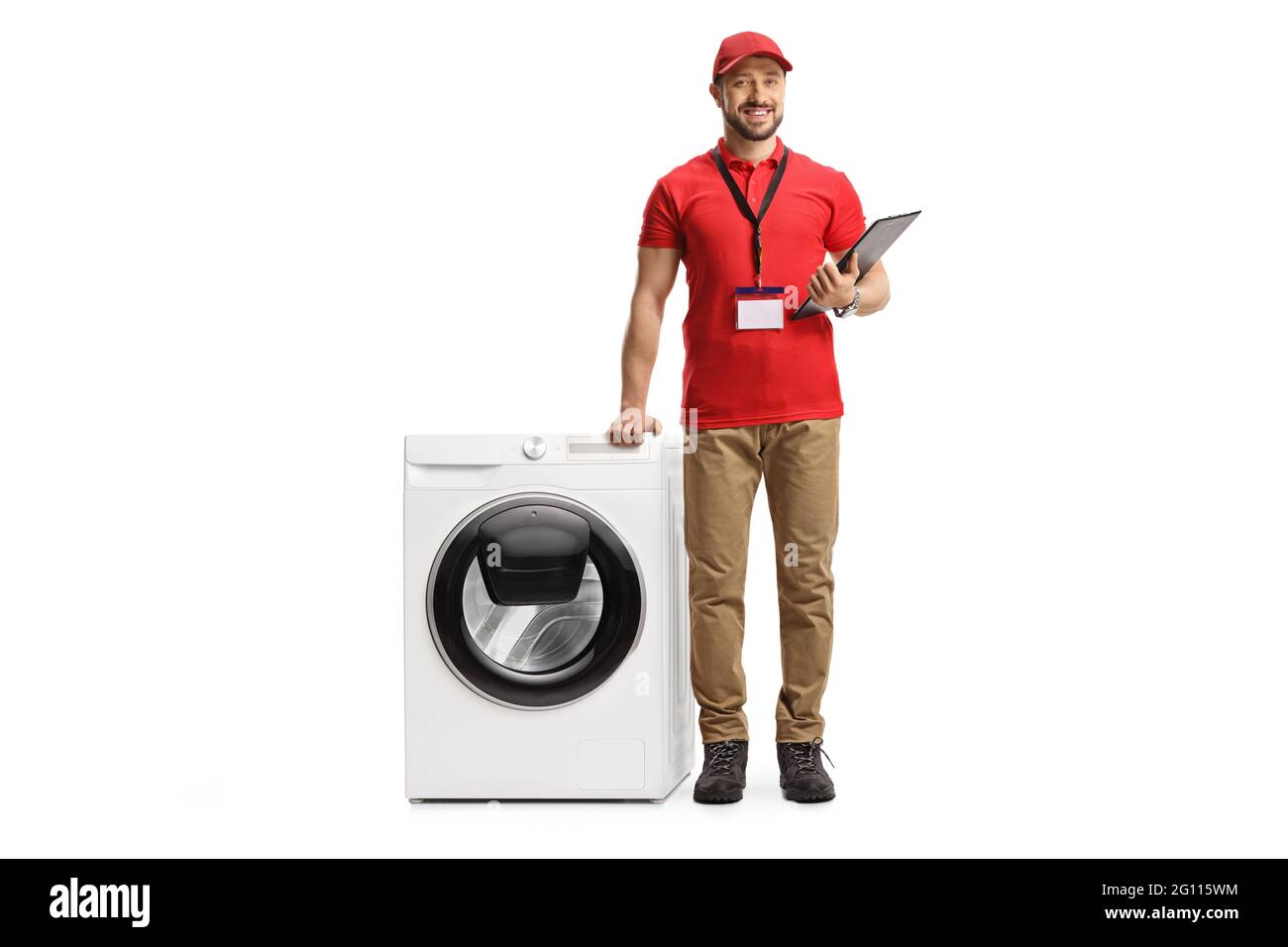 Full length portrait of a retail assistant leaning on a washing machine ...