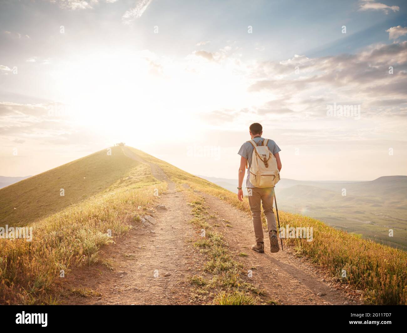 Young man travels alone walking on trail and enjoying on view of ...