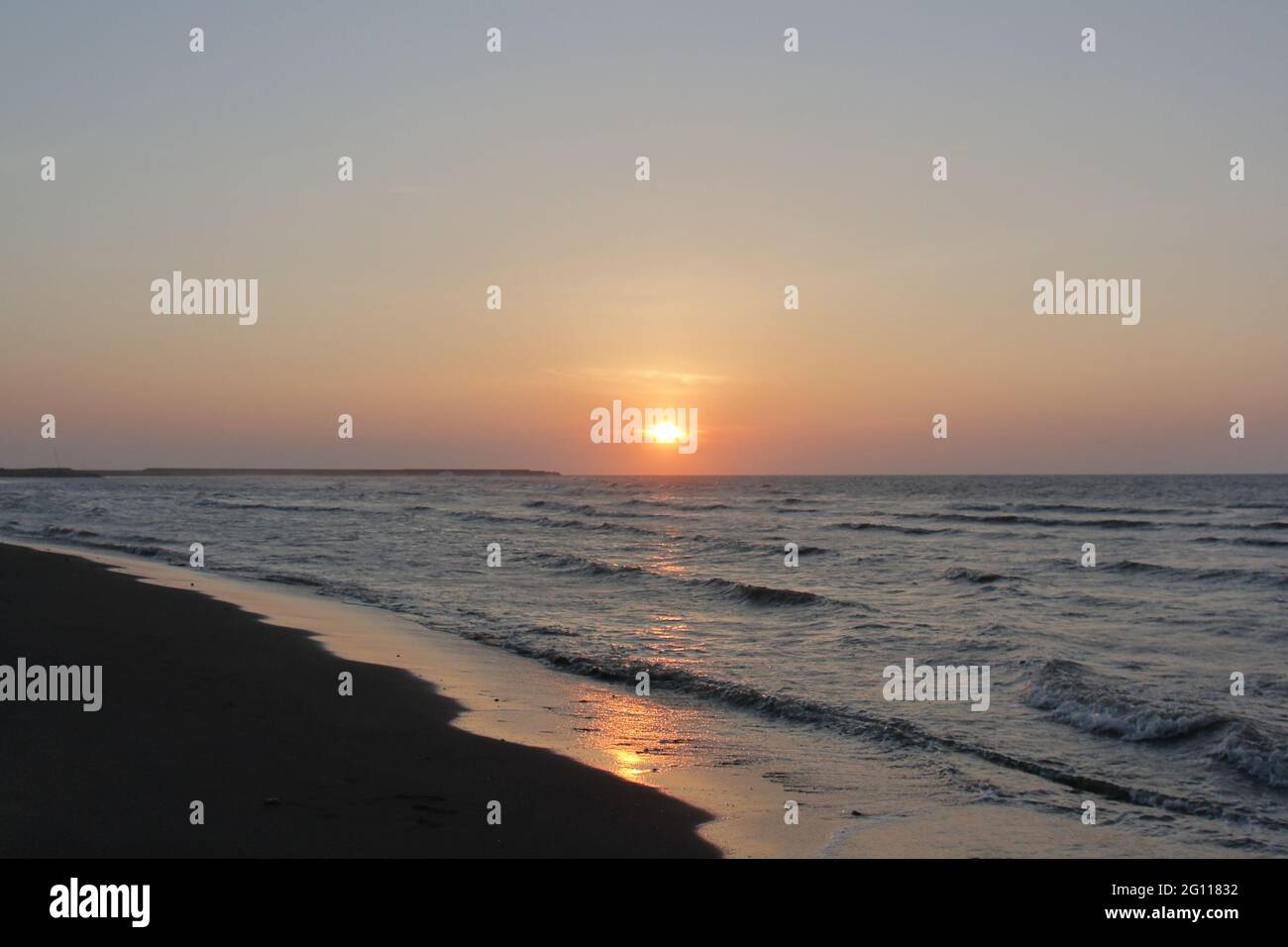 the beautiful and colorful sunset at the beach Stock Photo - Alamy