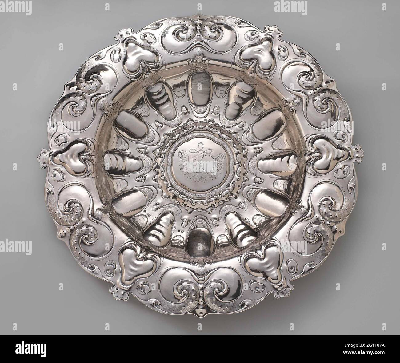 Silver scale. Scale of silver. Decorated with driven lobe ornament. An ...