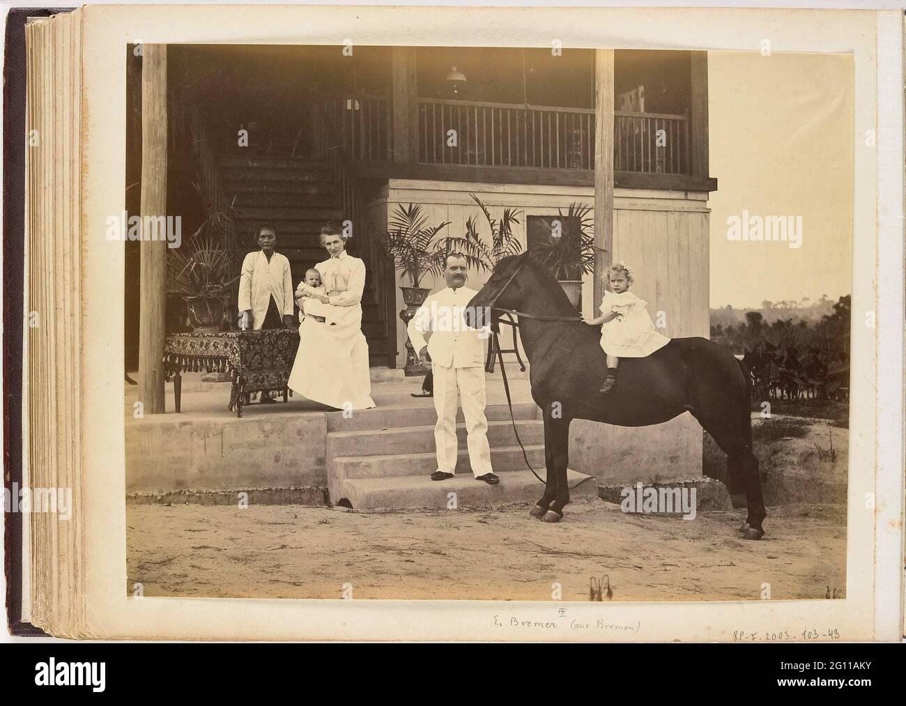 Portrait of E. Bremer with woman, children, served and horse in front ...
