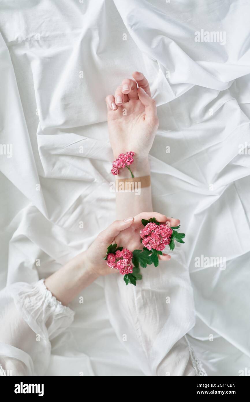 Creative spring floral aesthetics concept. Girls hands holding tender ...