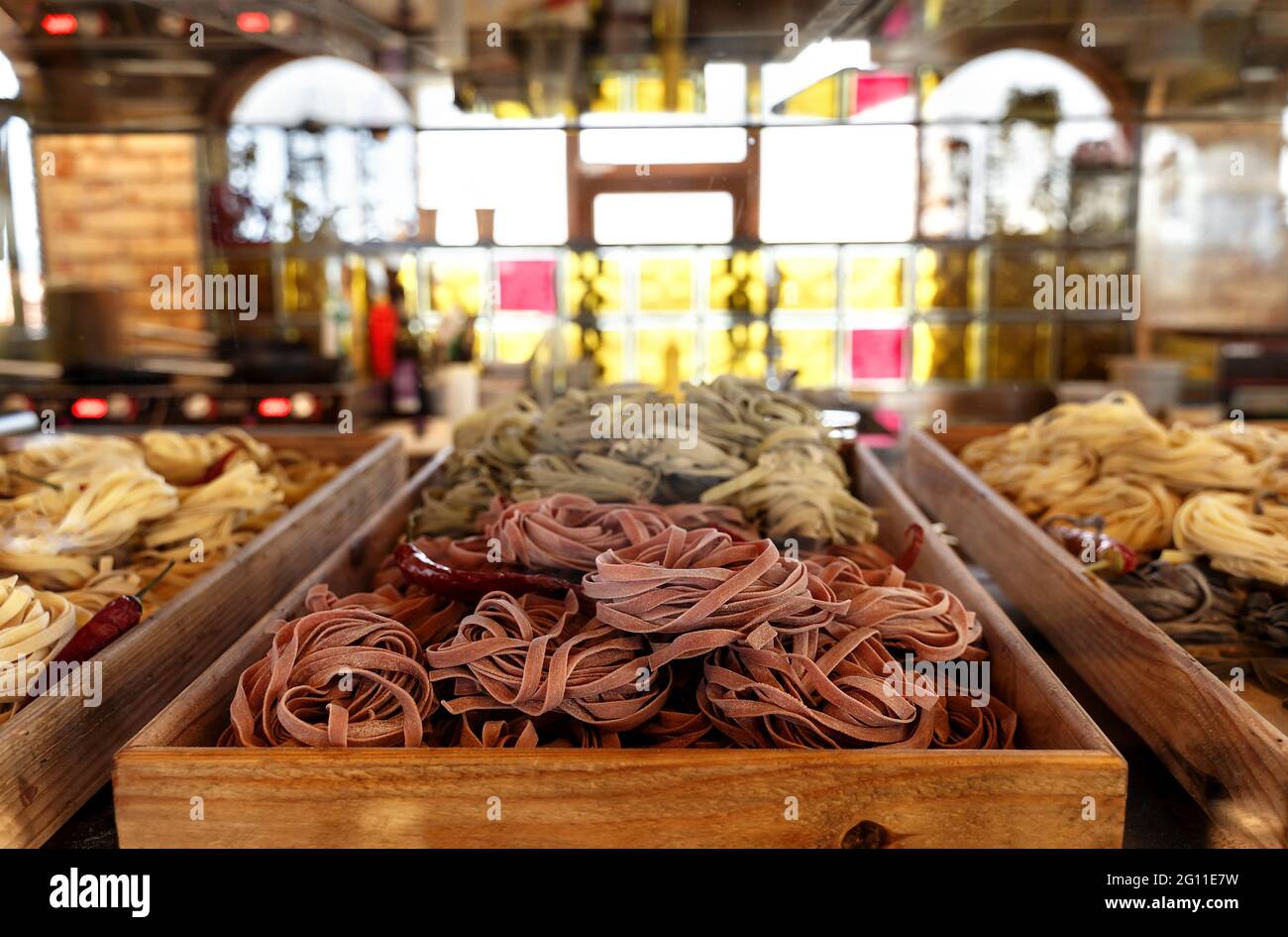 Pasta display on blurred Italian restaurant background. Restaurant ...