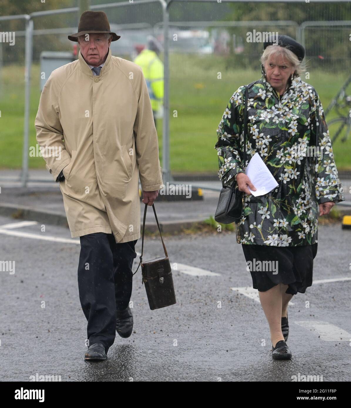 Epsom, United Kingdom. 4th June, 2021. Racegoers arrive at a wet Epsom ...