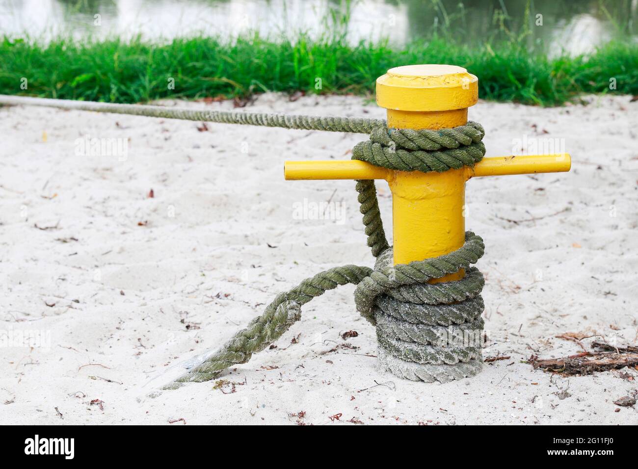 Sailingboat hawser on the beach. Summer time Stock Photo - Alamy