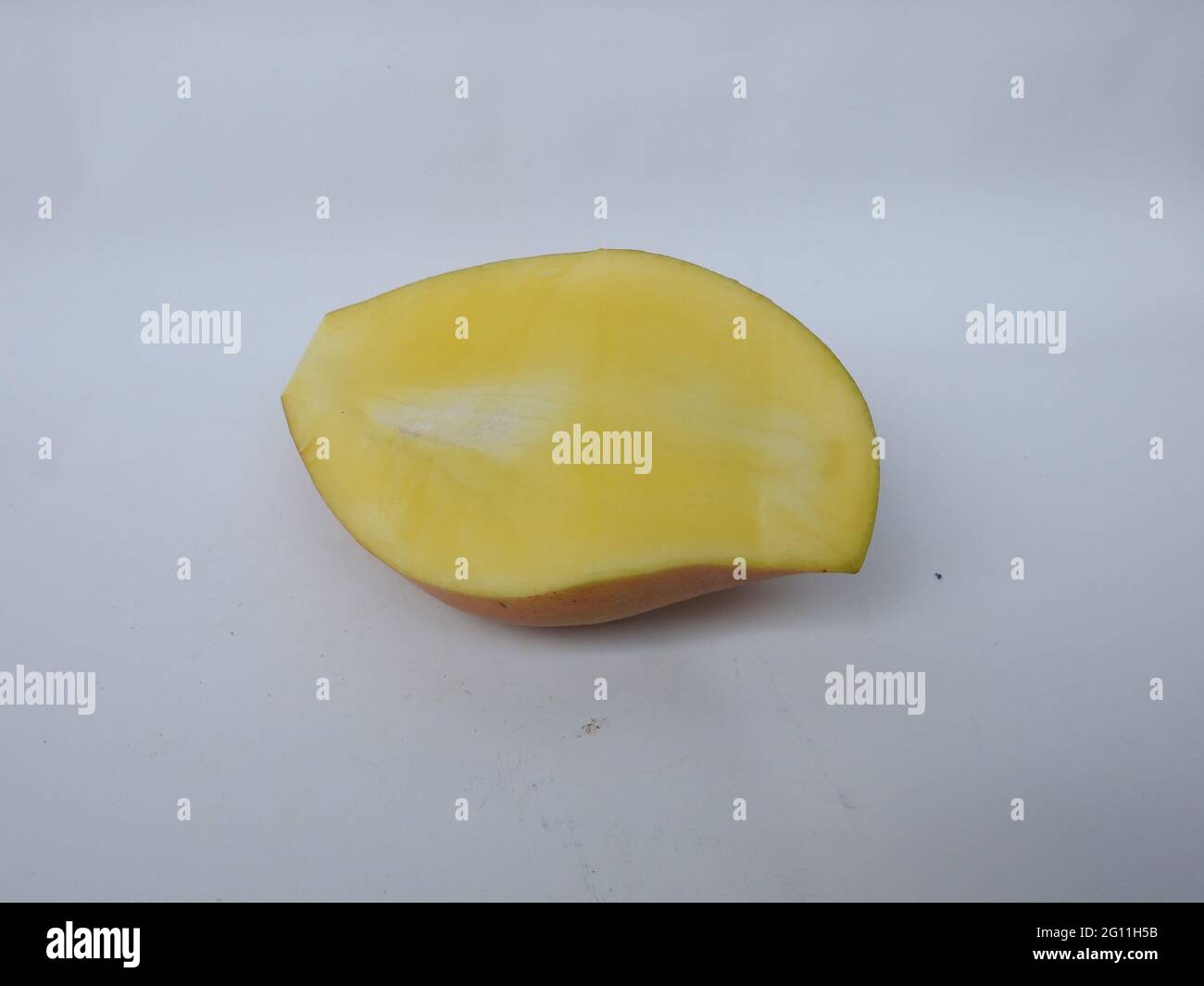 Closeup shot of a totapuri mango fruit isolated on white background ...