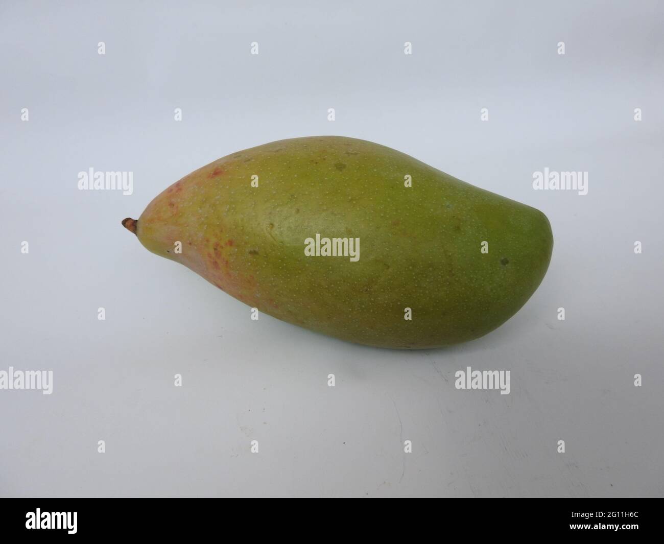Closeup shot of a totapuri mango fruit isolated on white background ...