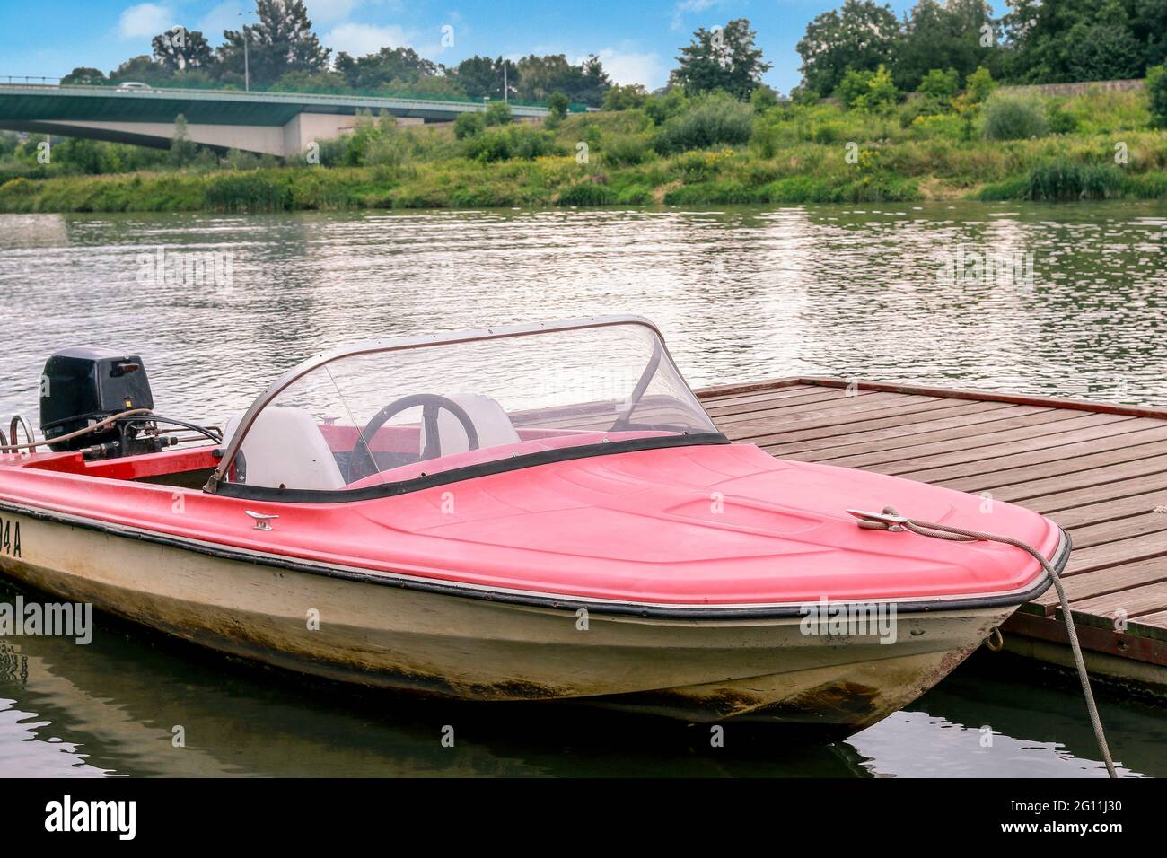 Small motorboat on Wisla river in Krakow, Poland Stock Photo - Alamy