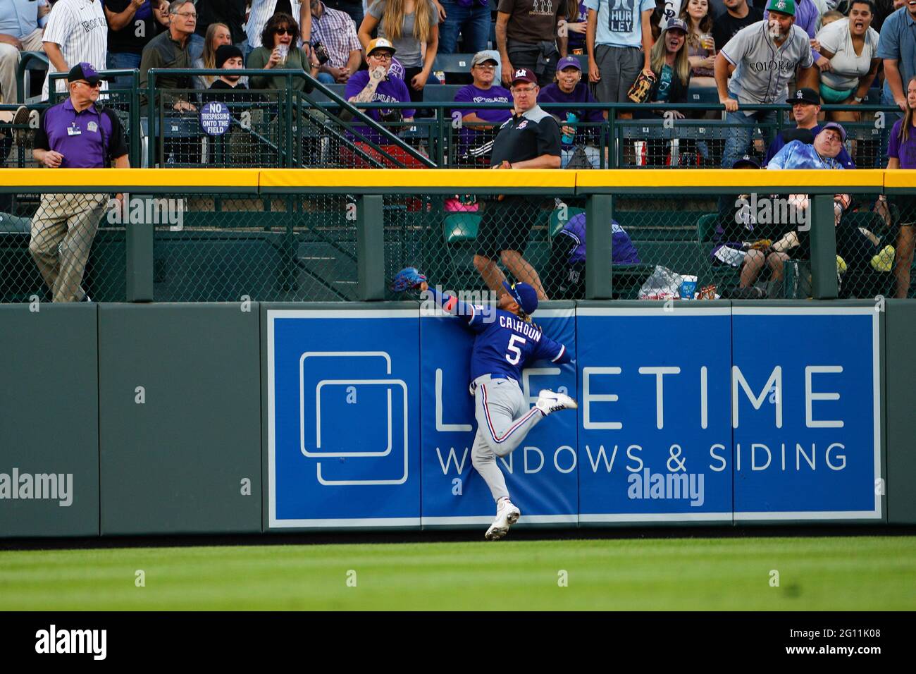 Texas Rangers outfielder Willie Calhoun (5) crashes into the wall to ...
