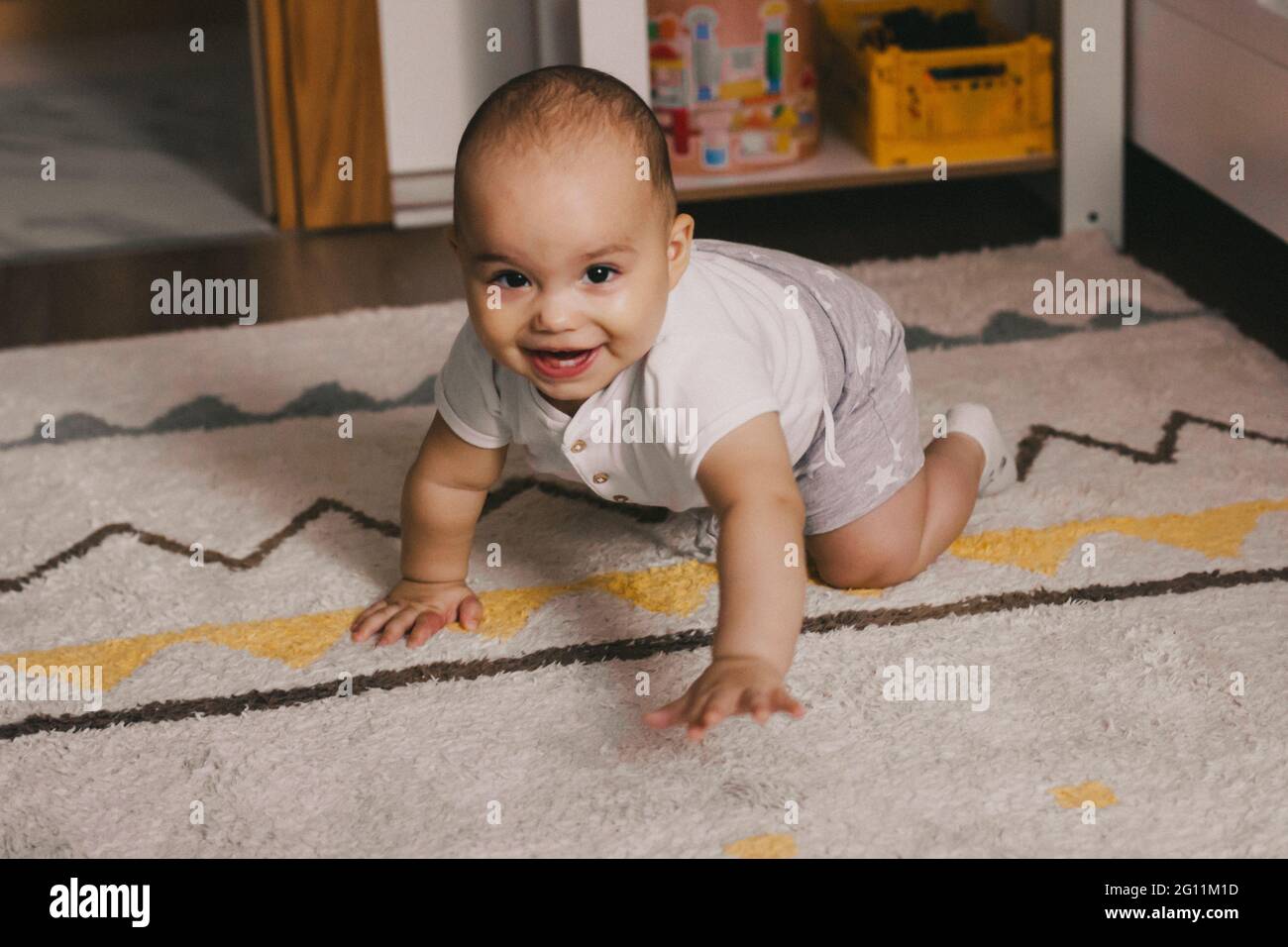 Toddler crawling playground hi-res stock photography and images - Alamy