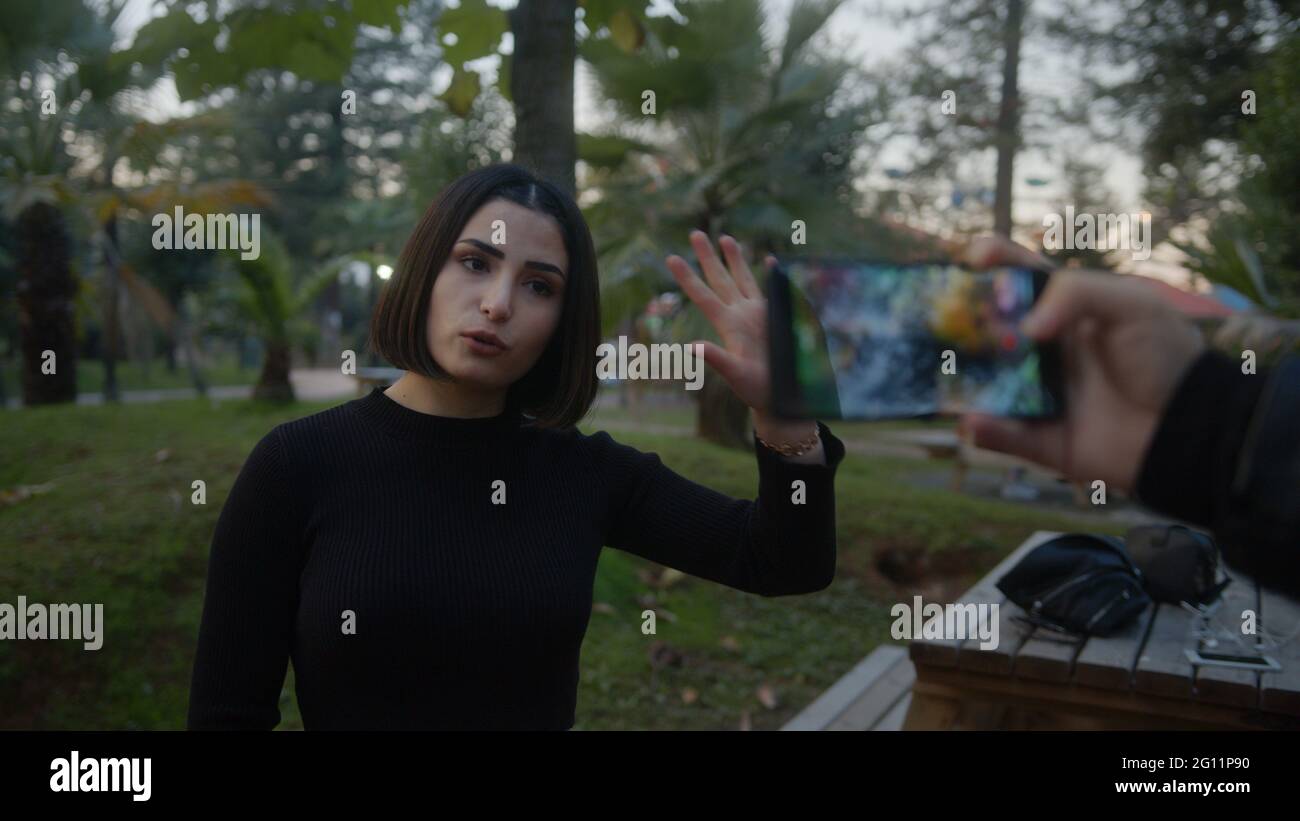 Beautiful smiling fashion blogger woman making online new video blog ...