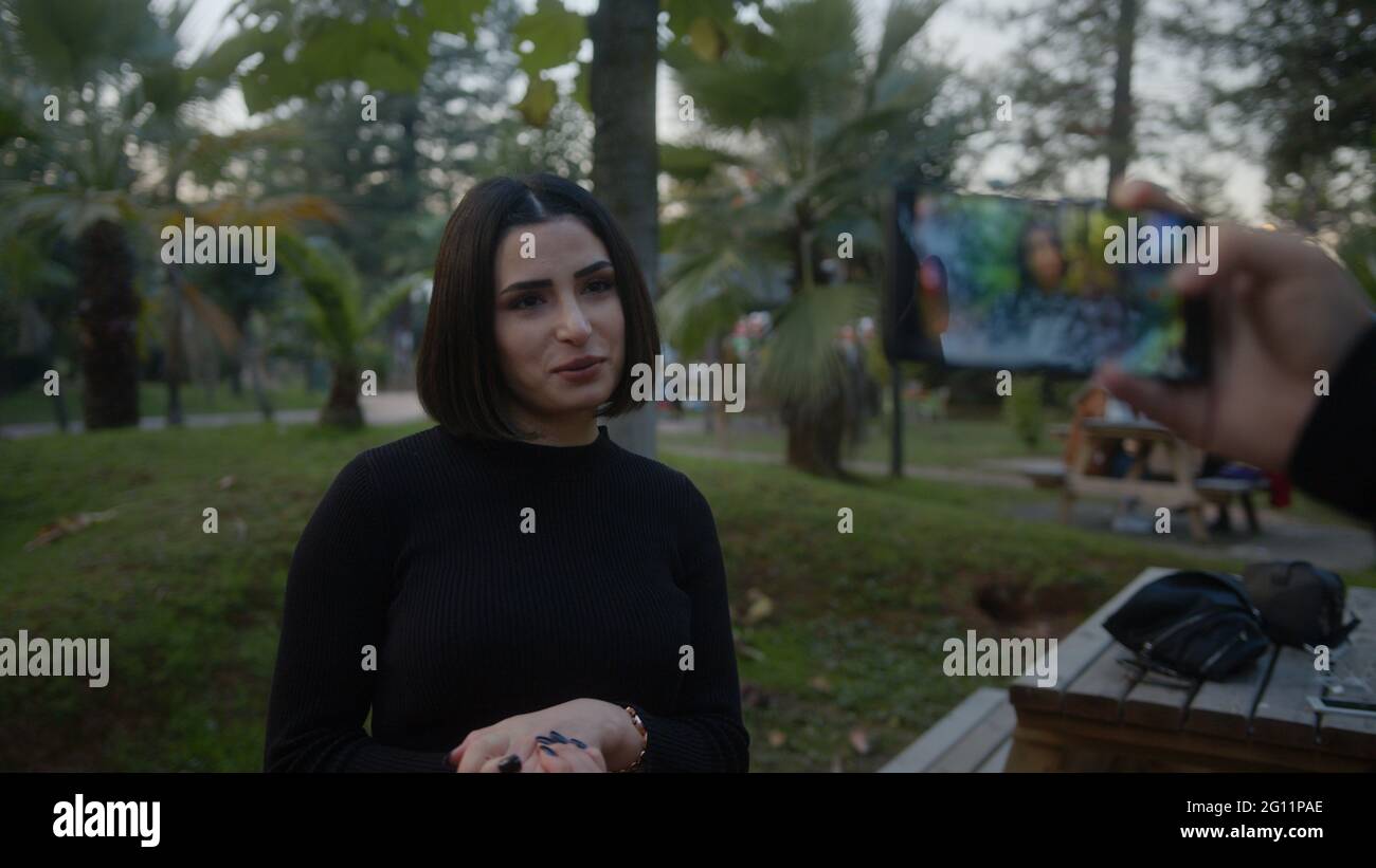 Beautiful smiling fashion blogger woman making online new video blog ...