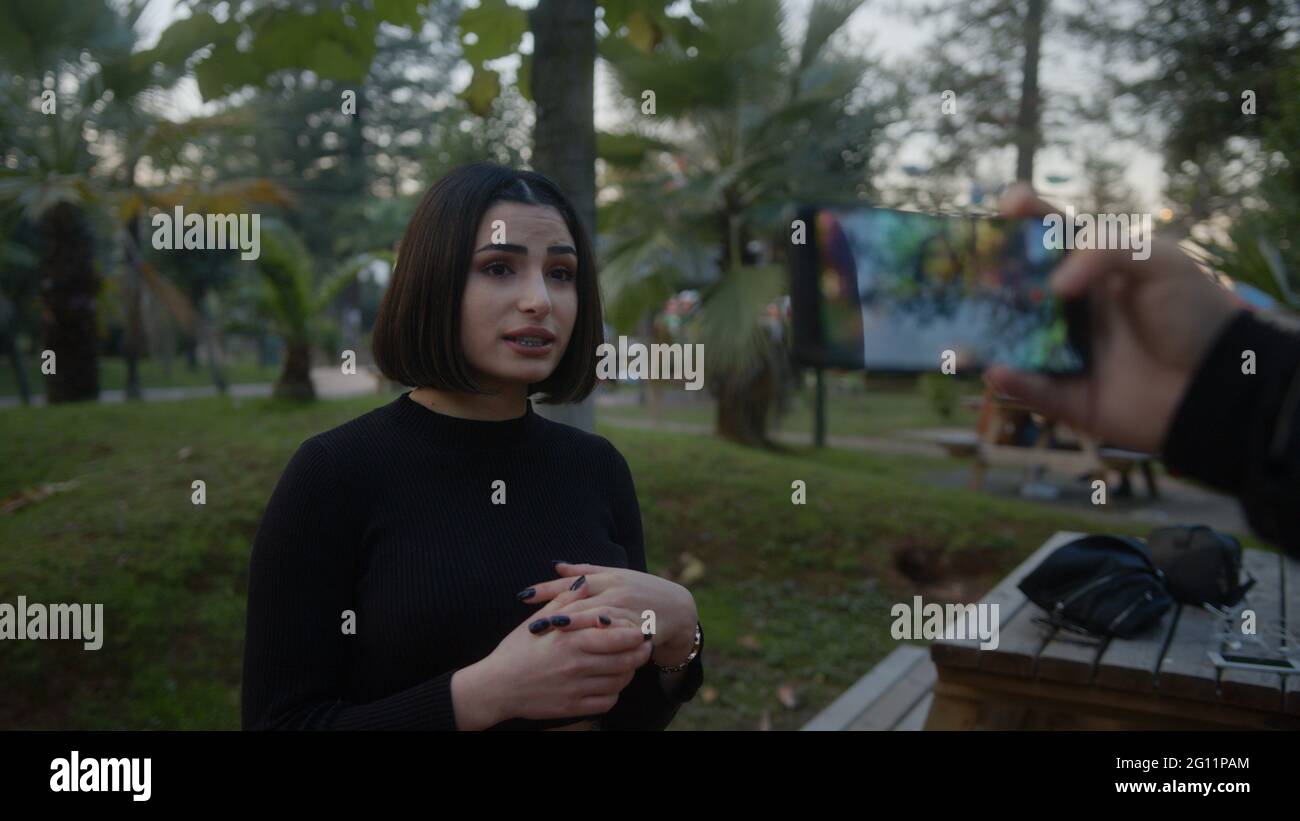 Beautiful smiling fashion blogger woman making online new video blog ...