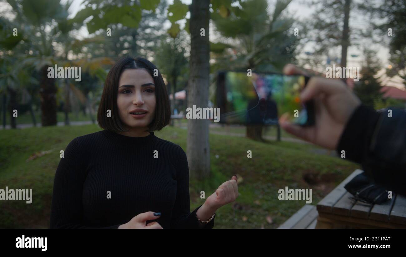 Beautiful smiling fashion blogger woman making online new video blog ...