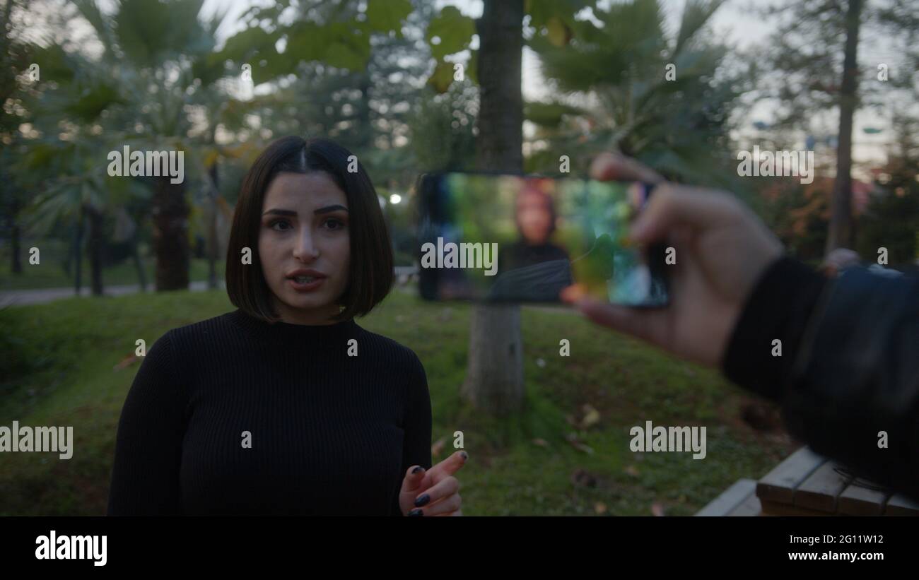 Beautiful smiling fashion blogger woman making online new video blog ...