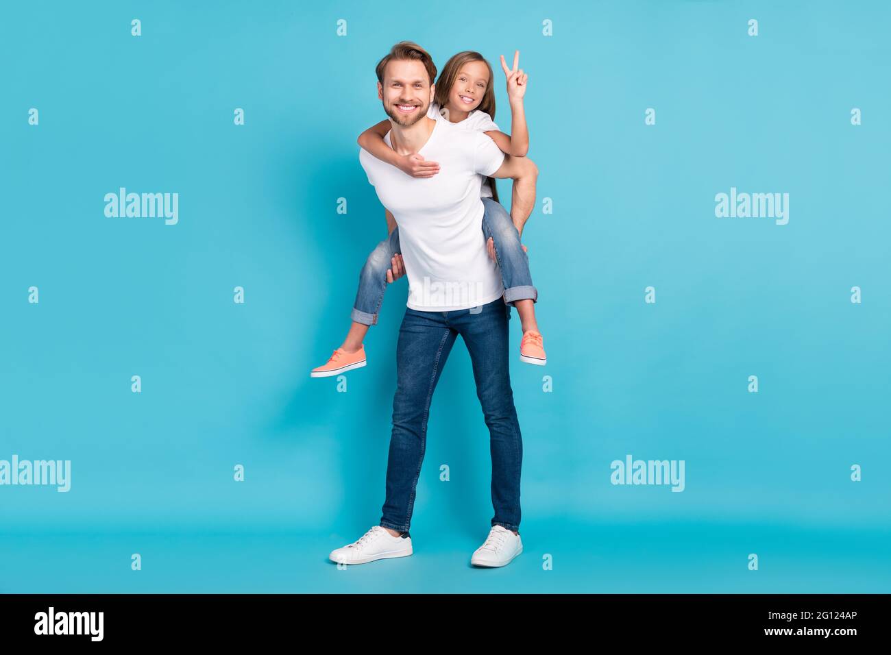 Full body portrait of cheerful guy hold on back piggyback carefree ...