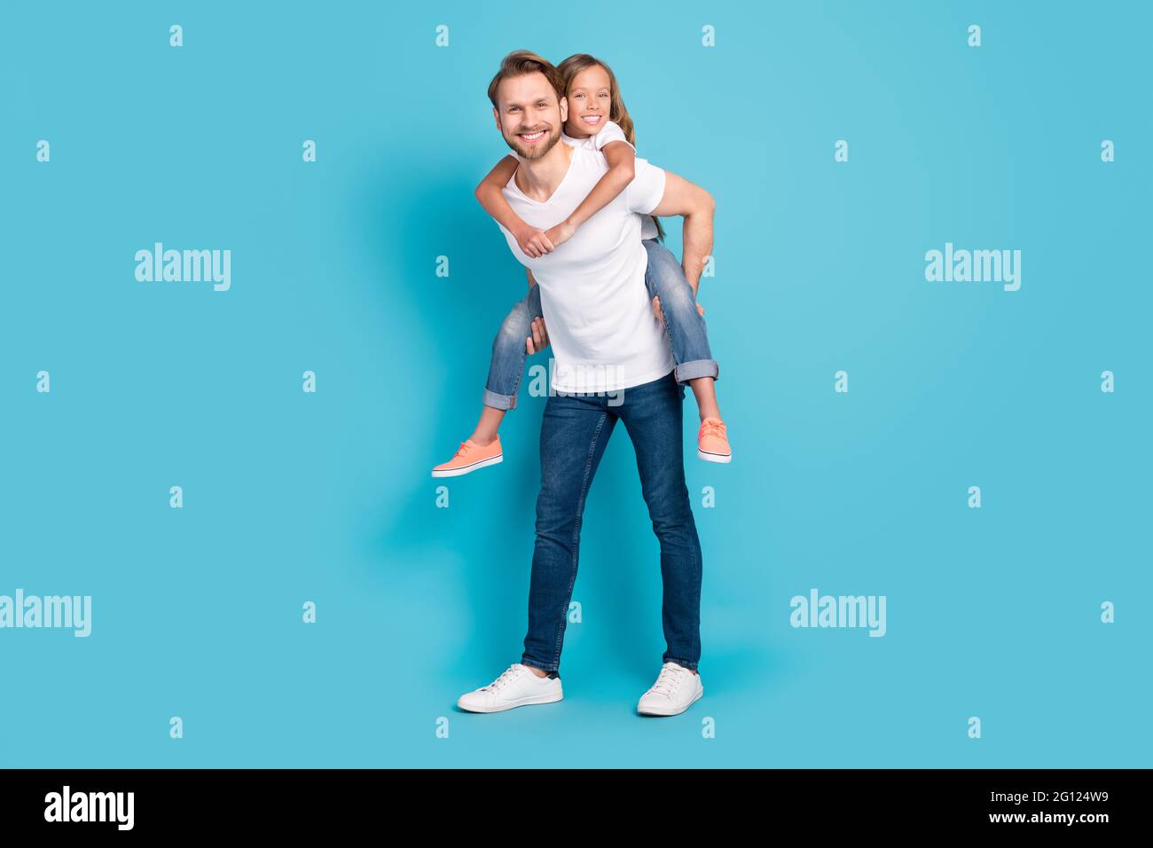 Full size photo of handsome guy hold on back piggyback adorable ...