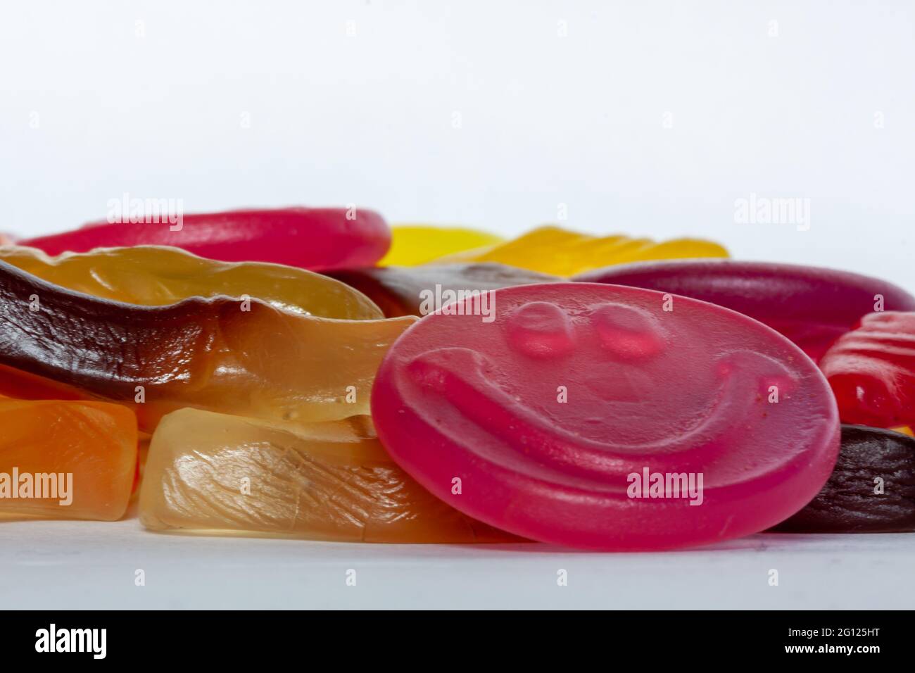 Closeup shot of smiley gummy isolated on white background Stock Photo ...