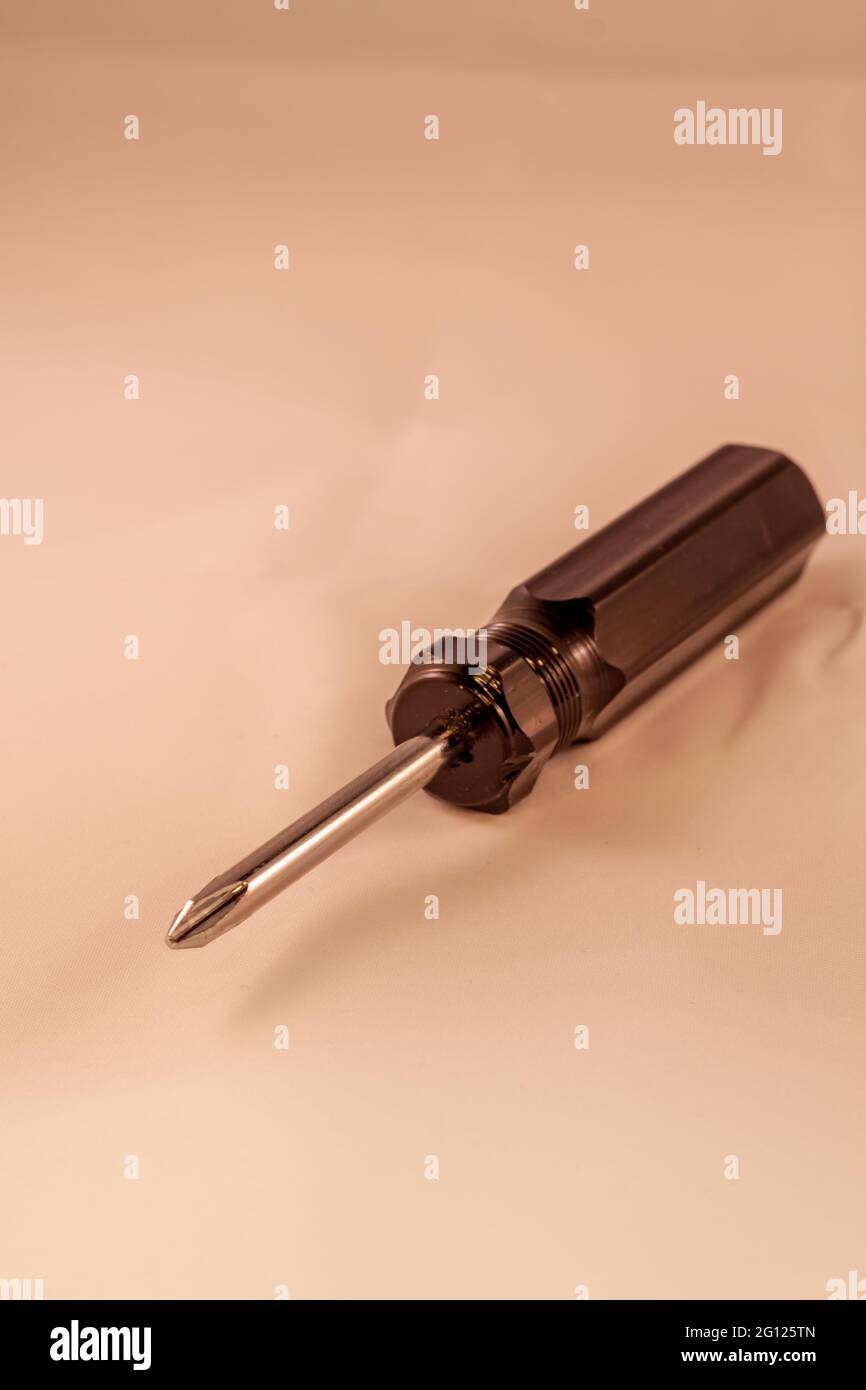 Vertical shot of a screwdriver on a white background Stock Photo - Alamy