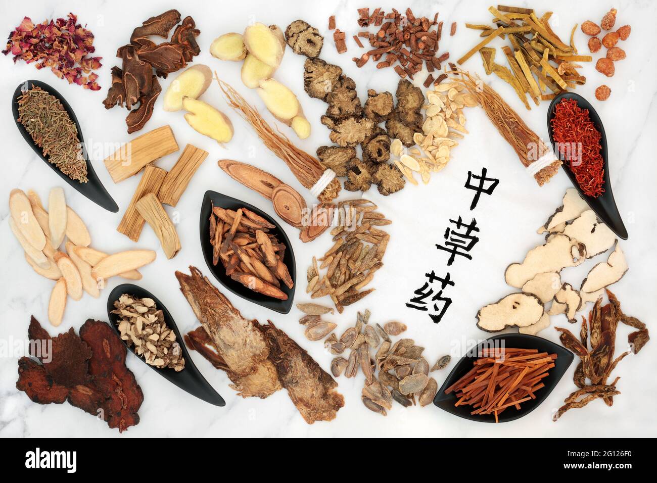 Chinese herbal medicine with a variety of herbs & calligraphy script on ...