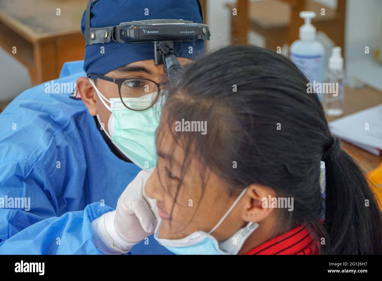 BALI/INDONESIA-MAY 28 2021: An ENT doctor is examining the ears, nose ...