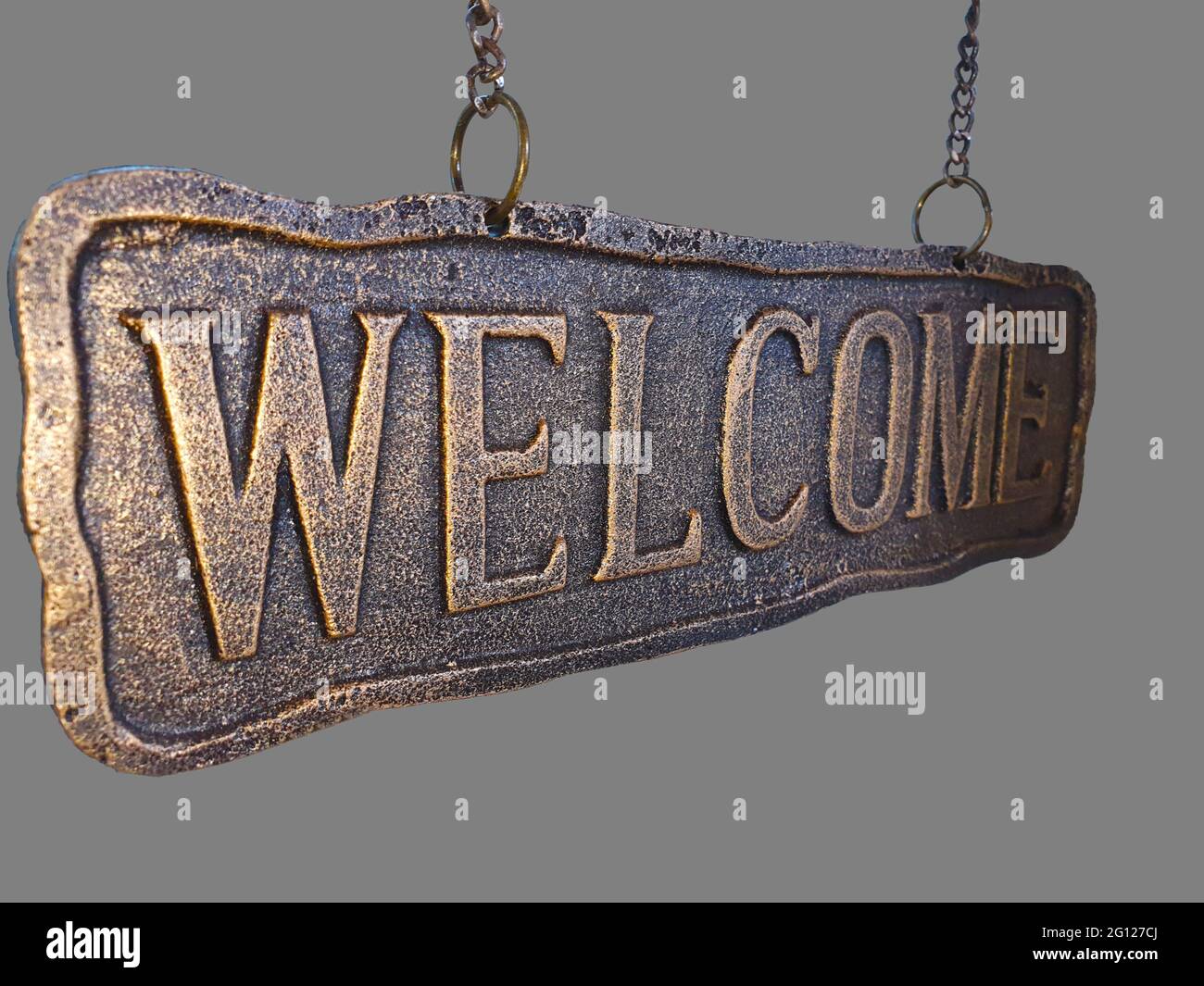 Closeup of a hanging metal Welcome sign isolated on a gray background ...