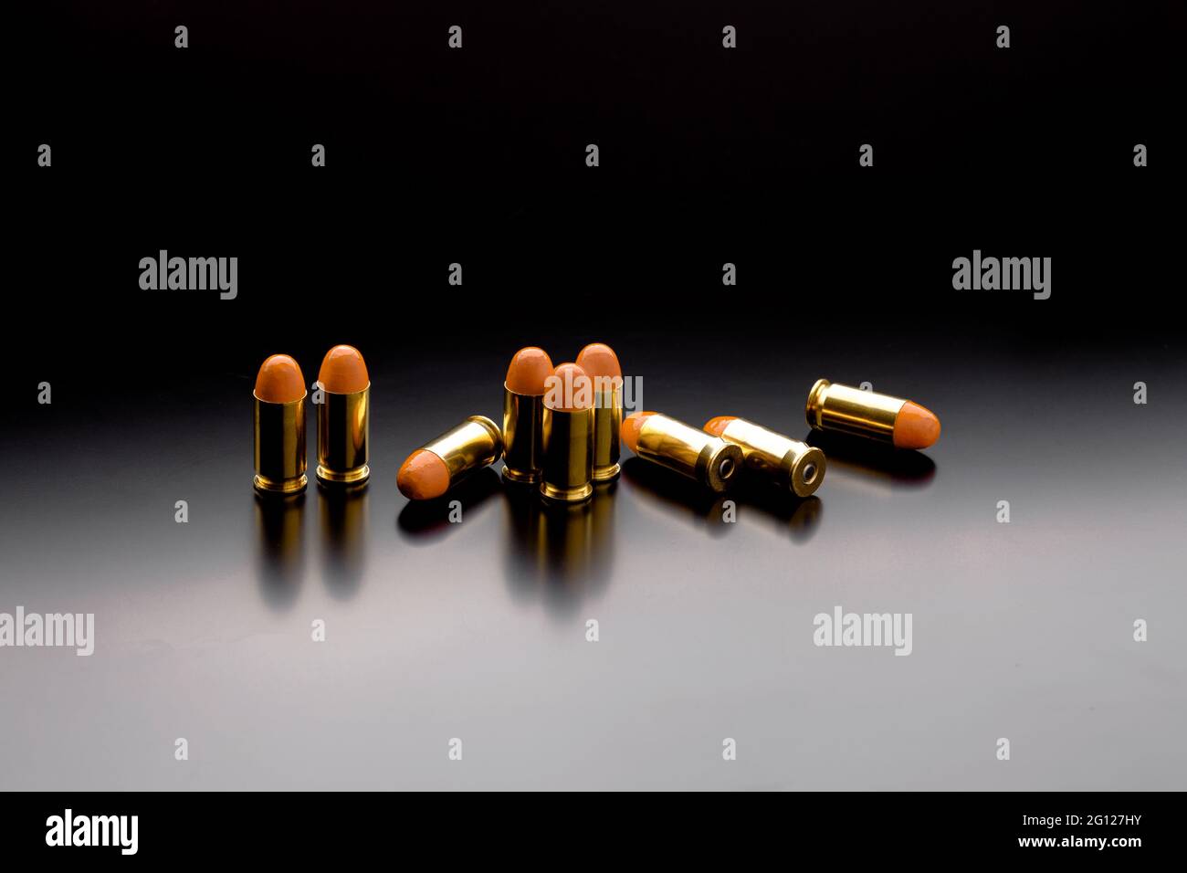 Bullet isolated on black background with reflexion. Pistol bullets ...