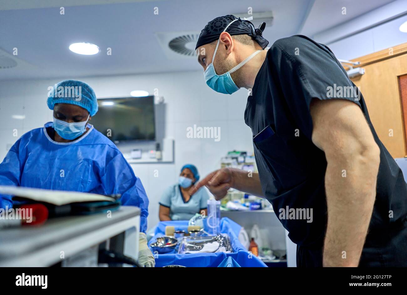 doctor and assistance Medical team performing surgery on a patient with ...