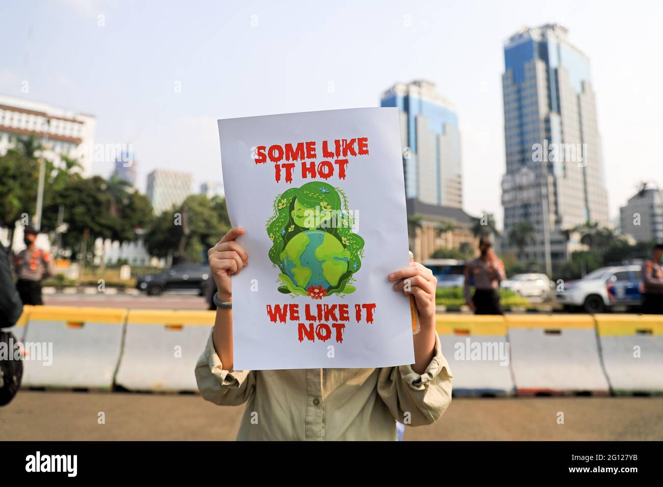 Jakarta, Indonesia. 04th June, 2021. An activist holding a placard ...