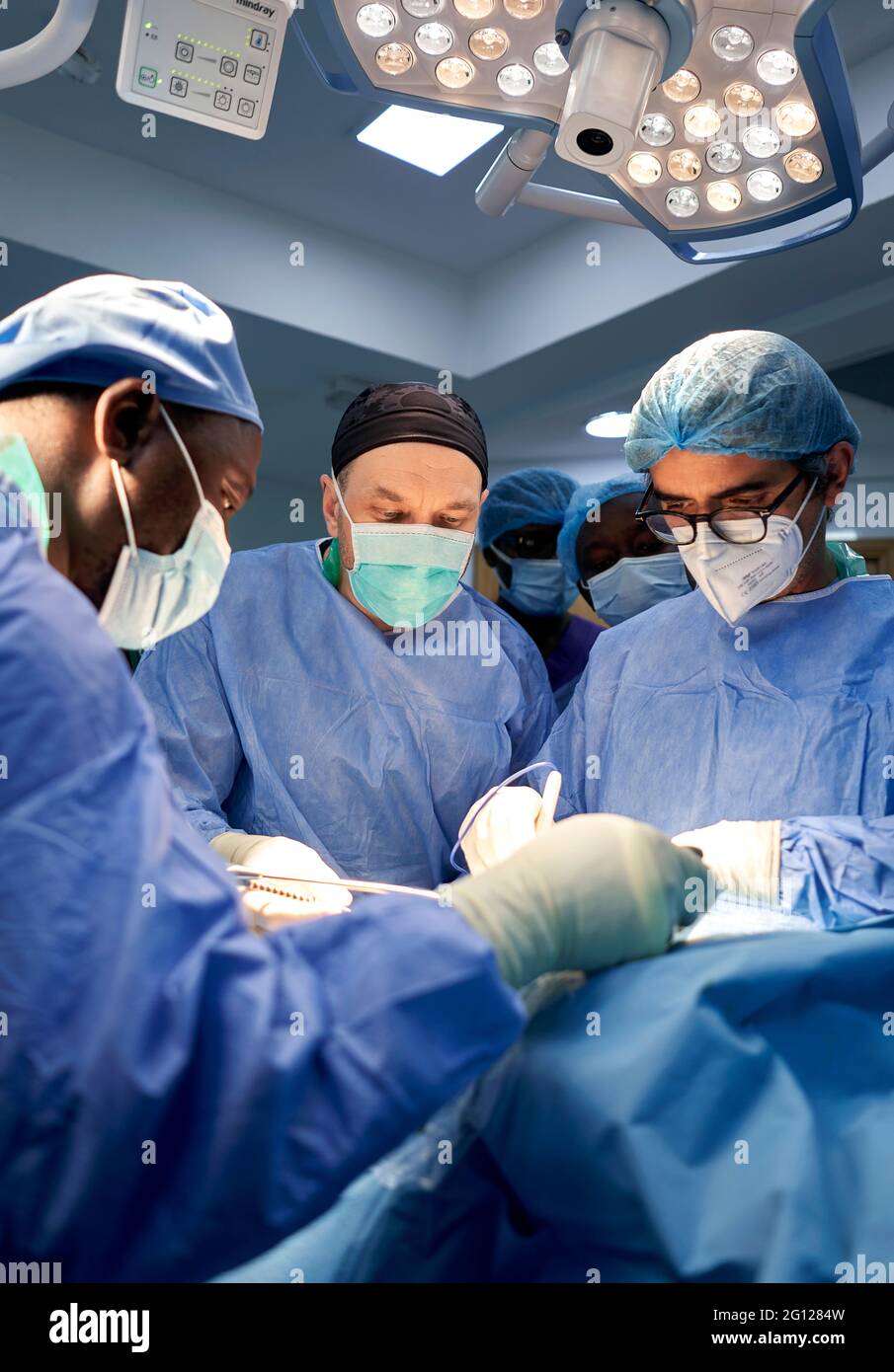 doctor and assistance Medical team performing surgery on a patient with ...