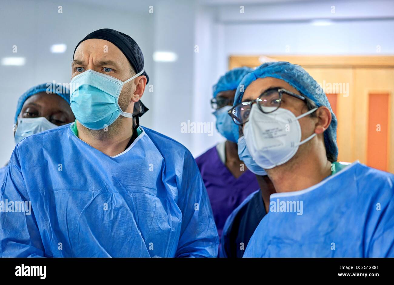 doctor and assistance Medical team performing surgery on a patient with ...