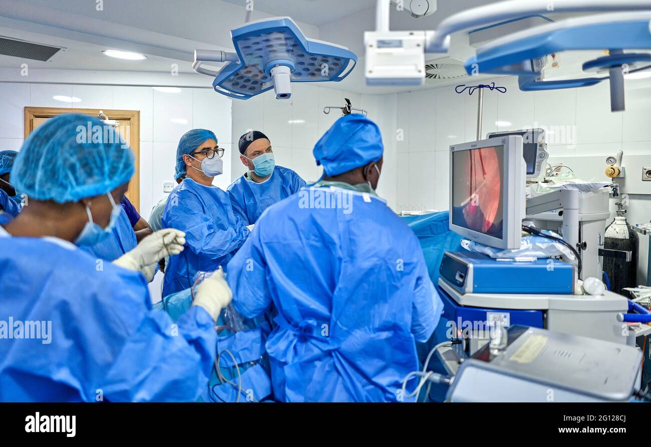 doctor and assistance Medical team performing surgery on a patient with ...