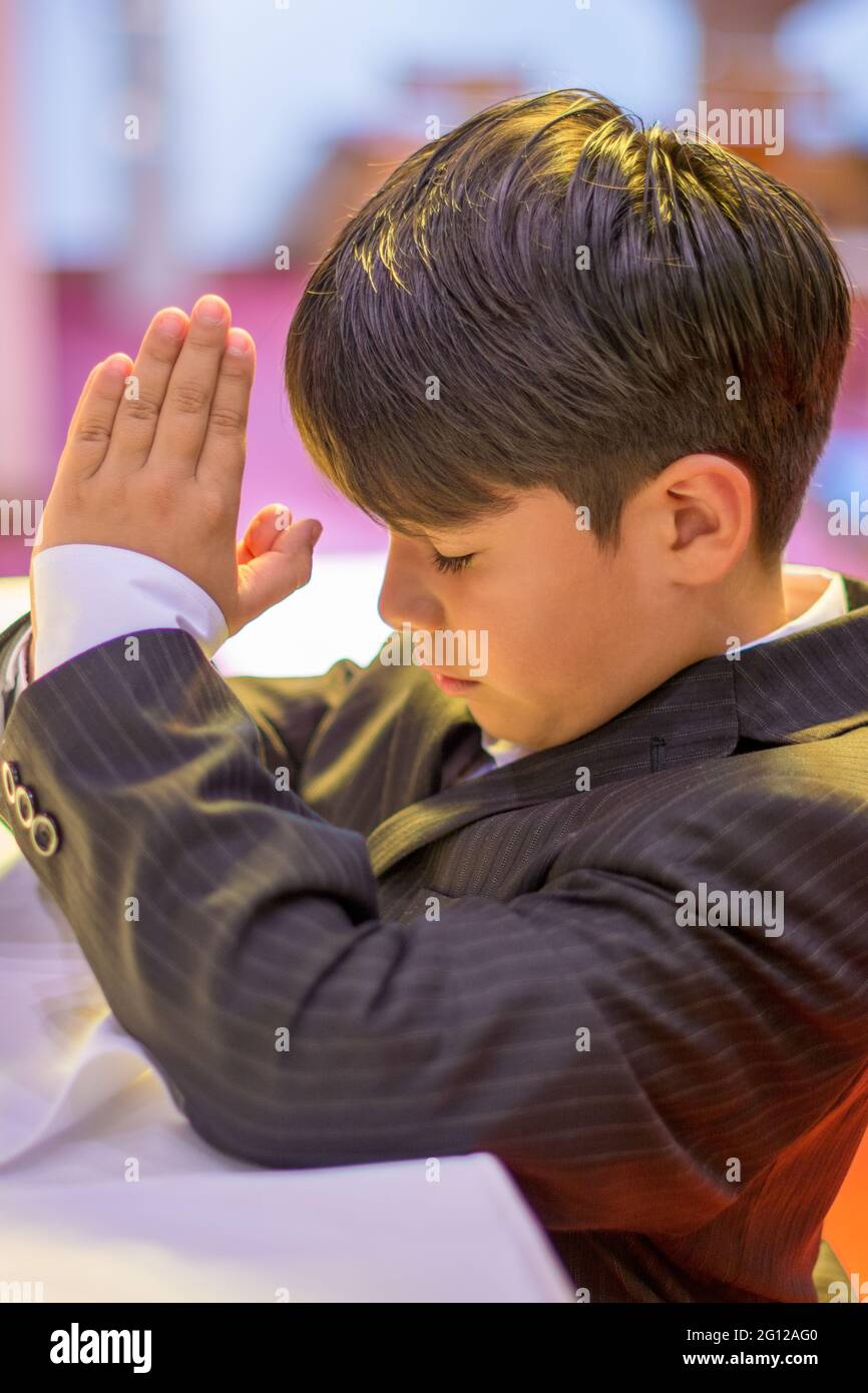 Boy praying catholic church hi-res stock photography and images - Alamy